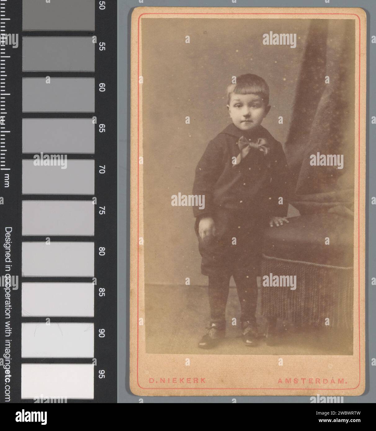 Portrait of an unknown boy, standing next to a chair, Dirk Niekerk ...