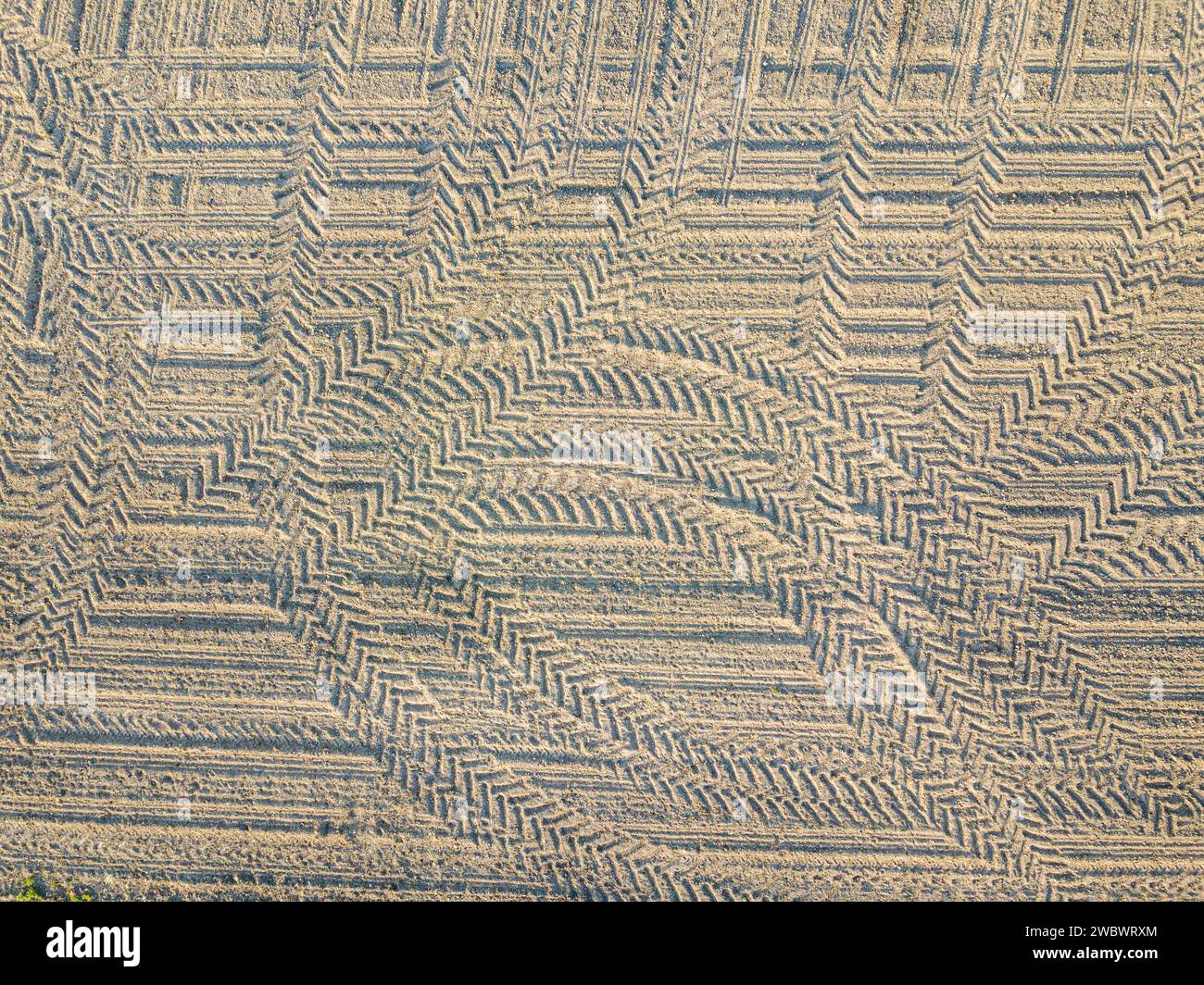 Tire marks in sand seen from above Stock Photo - Alamy