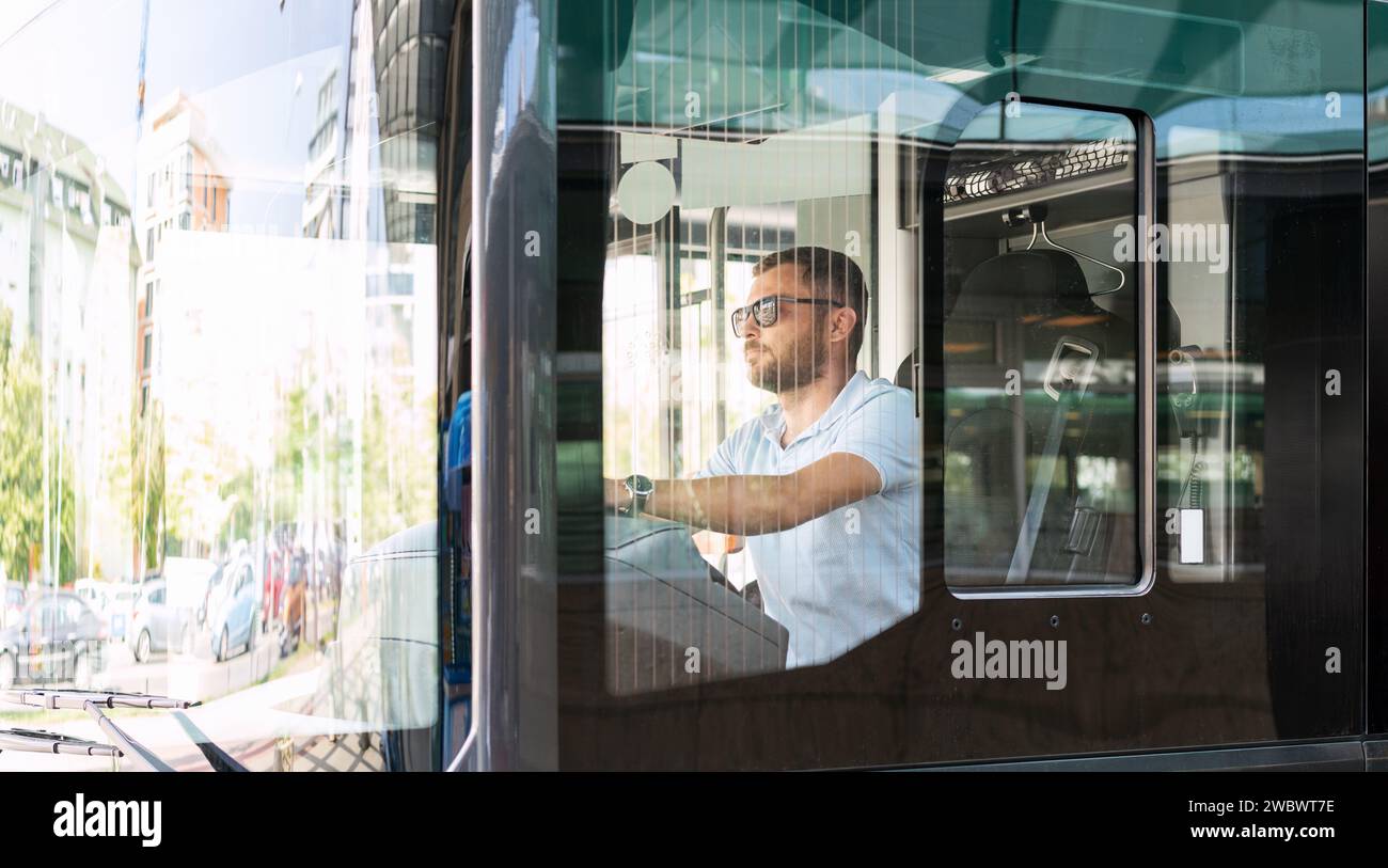 Labor Day banner. Man bus driver driving bus Stock Photo - Alamy