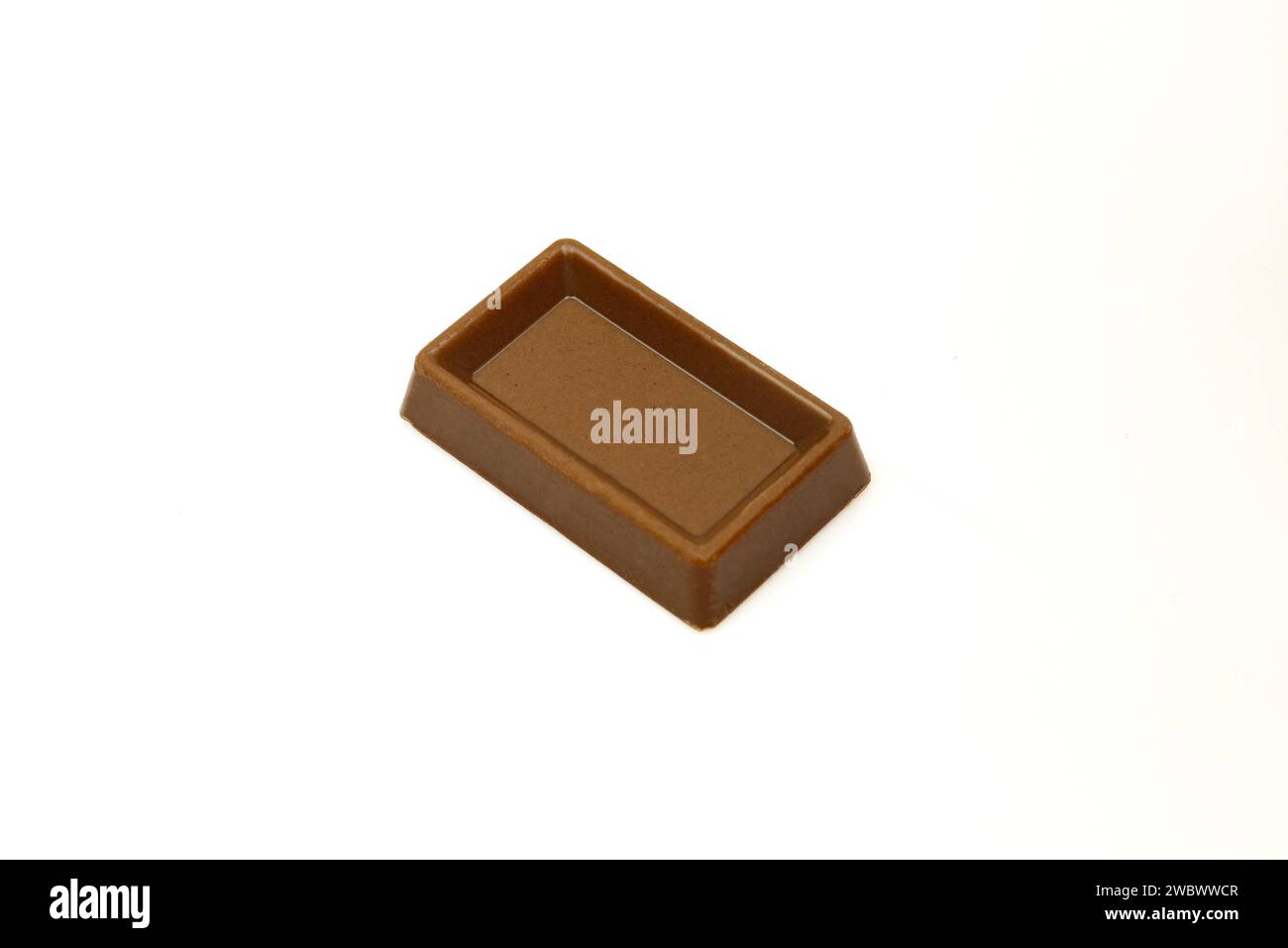 Bite size,milk chocolate square shaped treat isolated on white ...