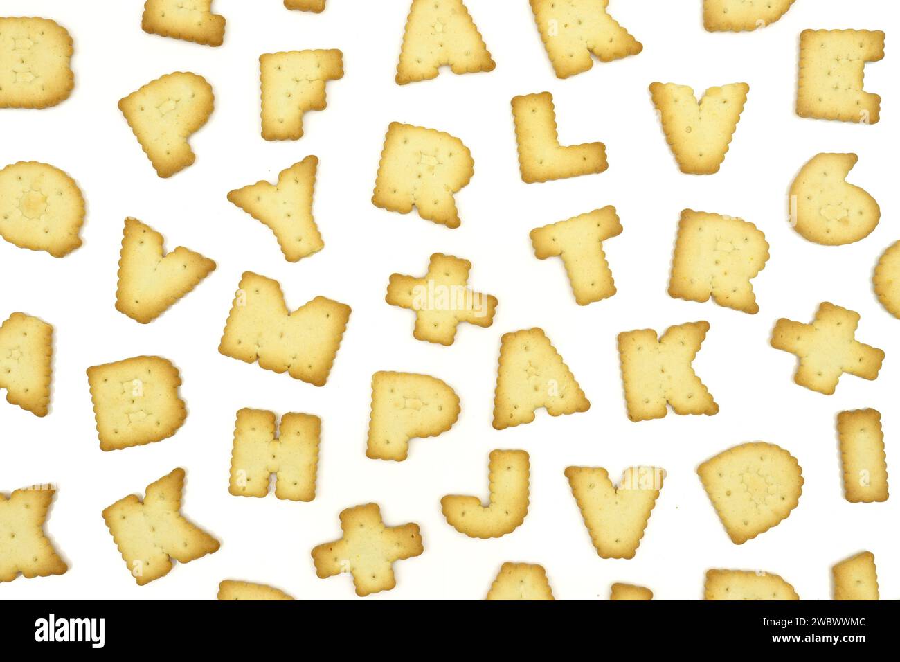 Many letter shaped biscuits isolated on white background. Texture ...