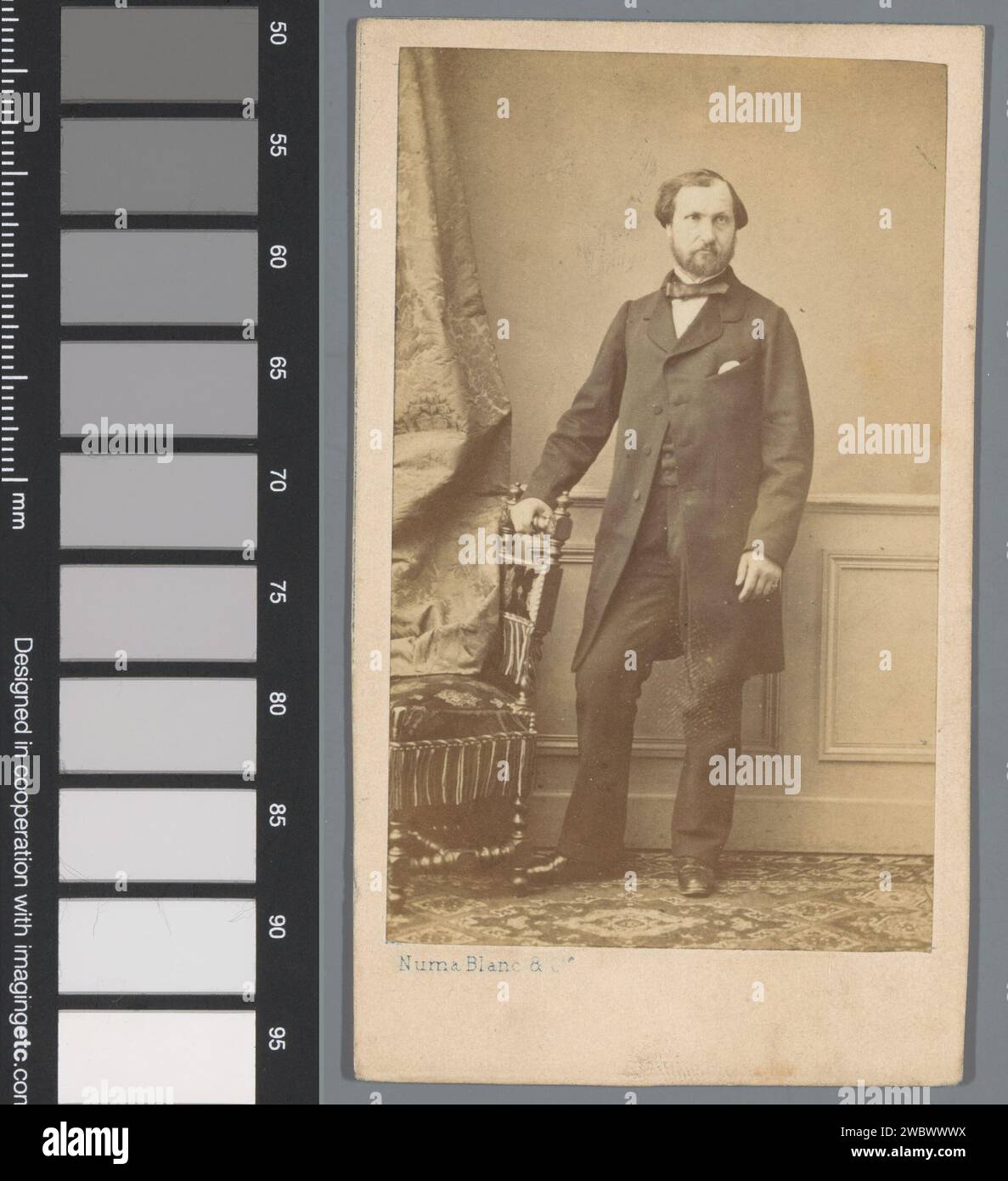 Portrait of an unknown man, standing next to an armchair, N. Blanc et ...