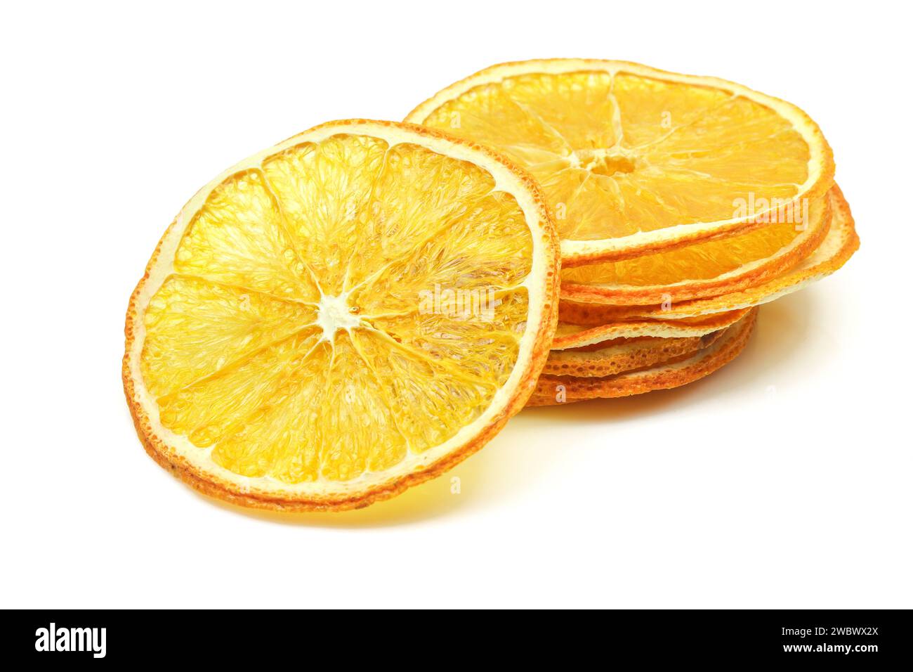 Stacked dehydrated slices of dried orange isolated on white background ...
