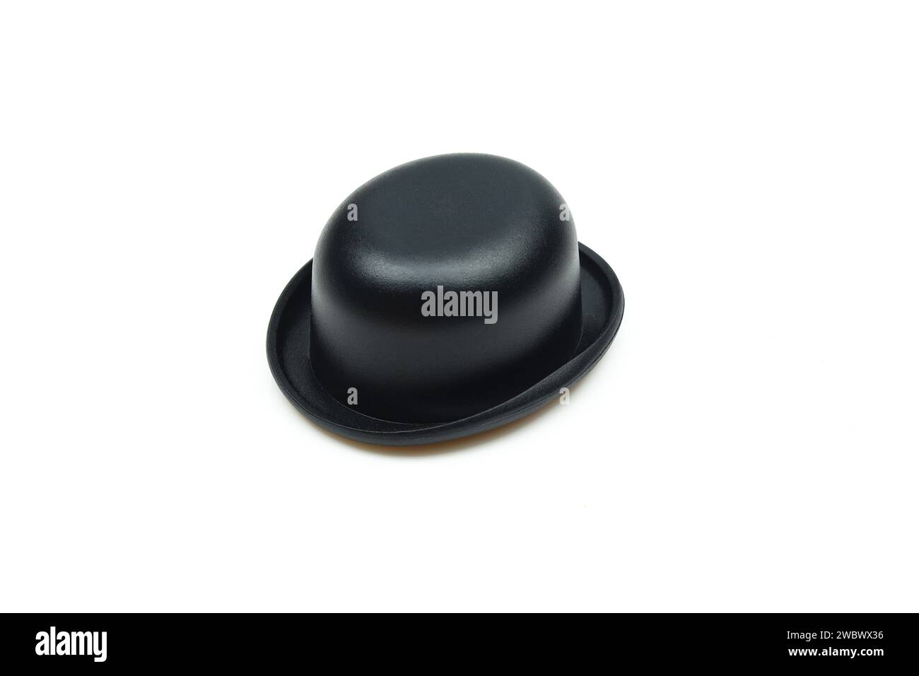 Small black plastic hat isolated on white background Stock Photo - Alamy