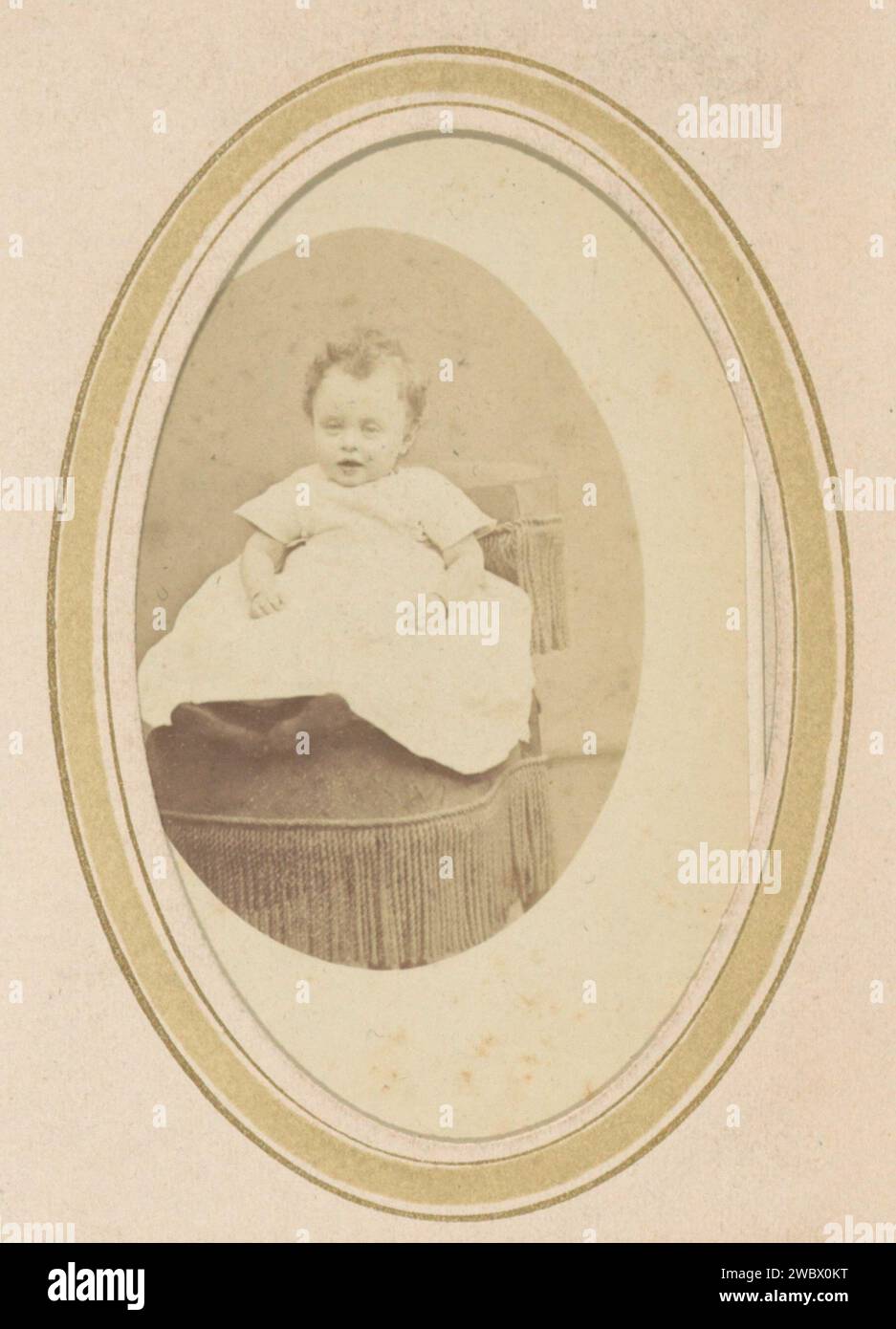 Portrait of a baby in a dress on an armchair, anonymous, c. 1860 - c ...