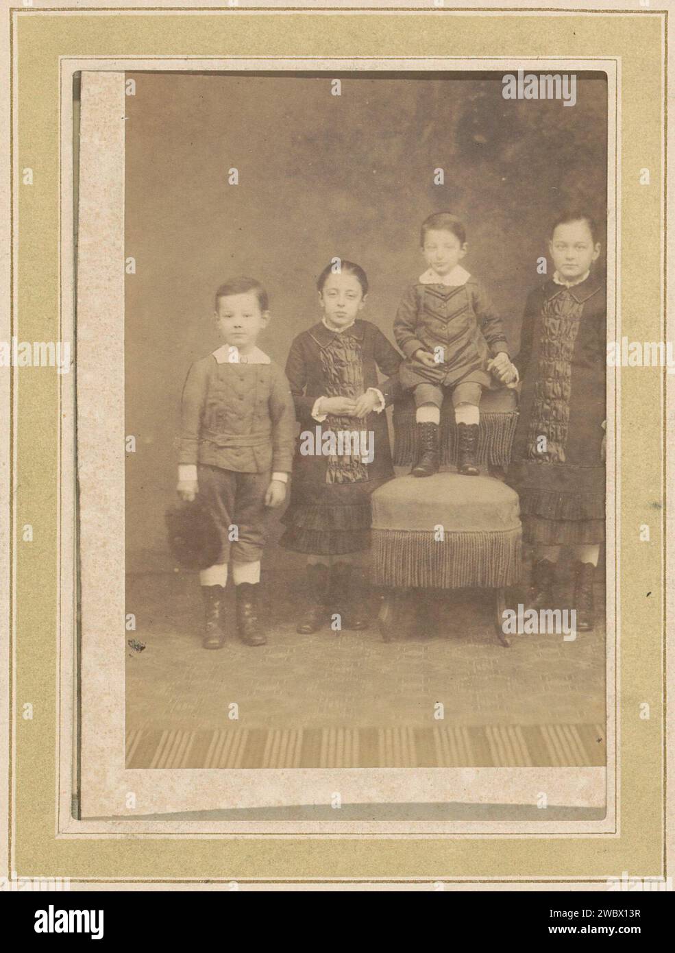 Portrait of four children at a chair, anonymous, c. 1870 - c. 1900 ...