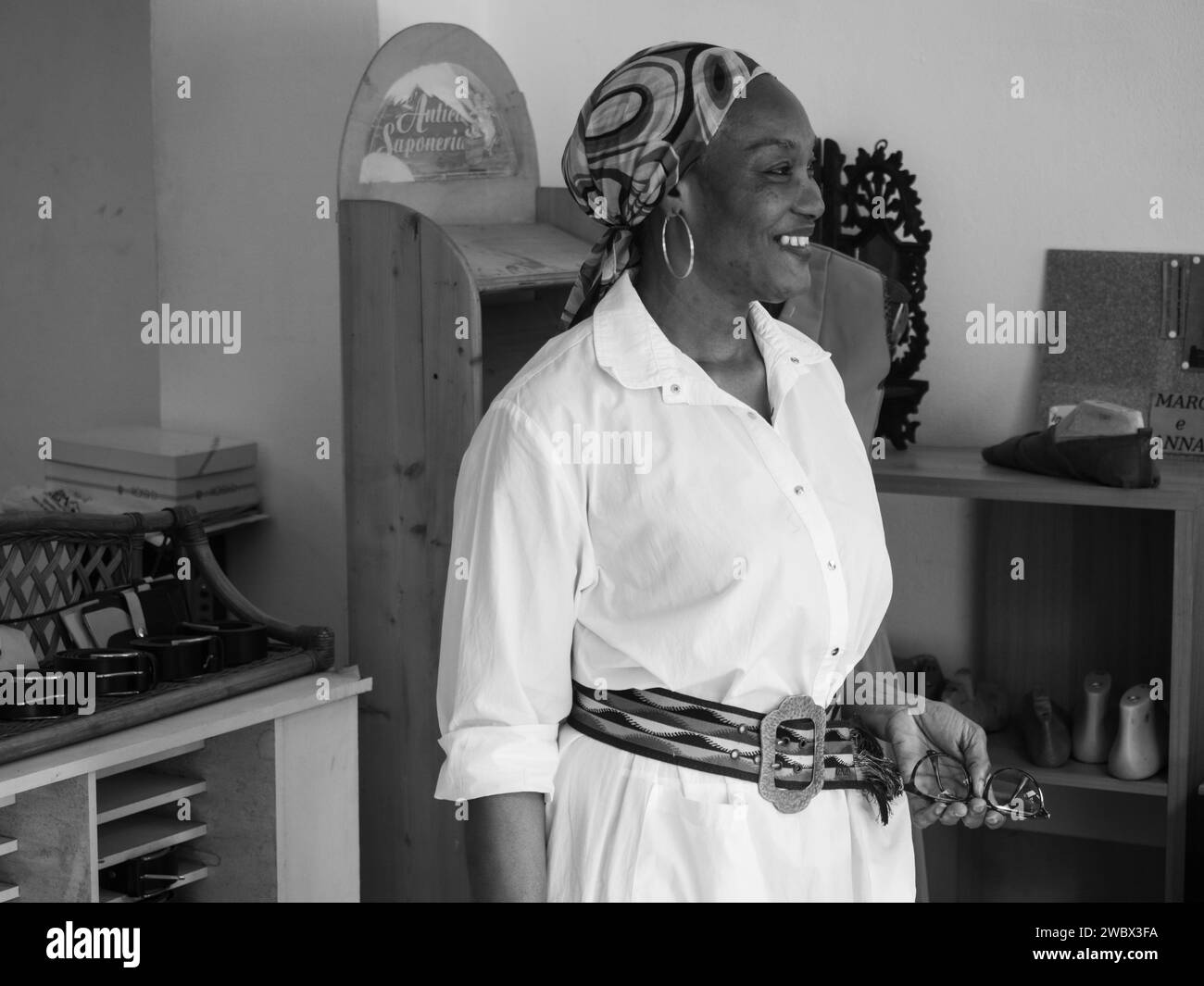 African fit adult 50s tall woman woman wearing a white dress and a ...