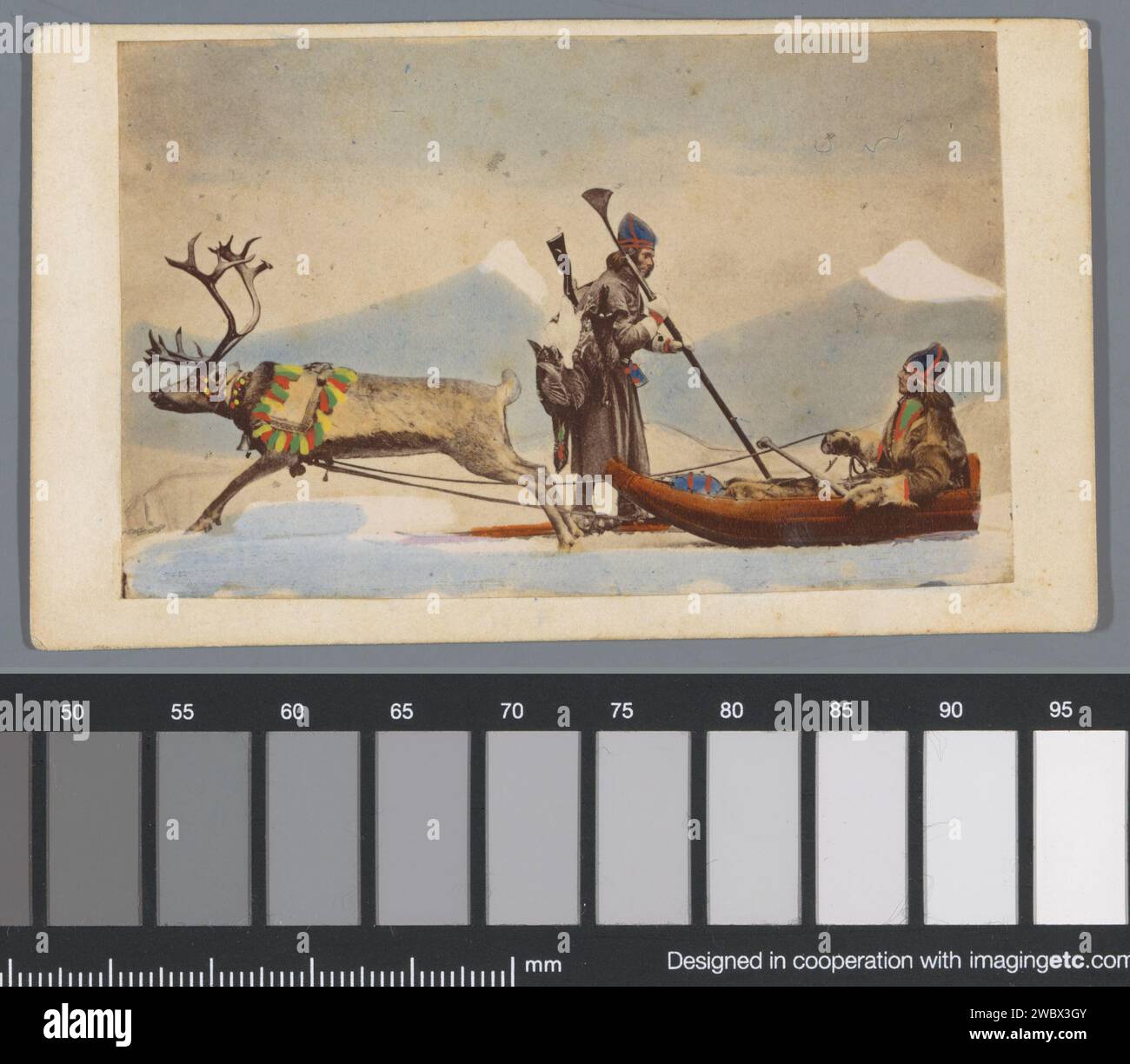 Two men with reindeer sled in traditional costumes from Åsele, Sápmi ...