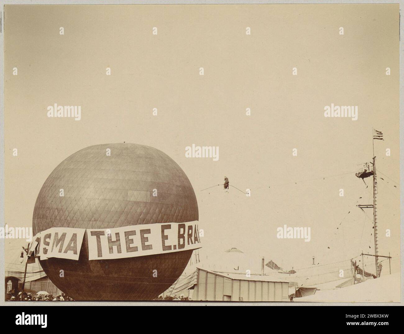 Ballon with advertising for 'Thee E. Brandsma', in the background a ...
