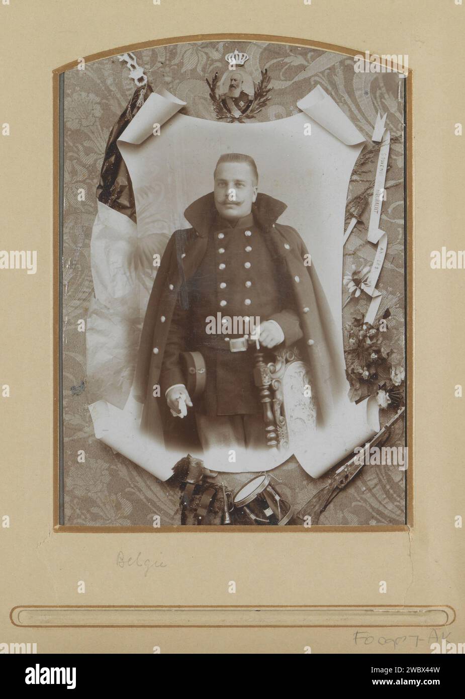 Portrait of a Belgian soldier, framed with rifle, drum, miniature ...