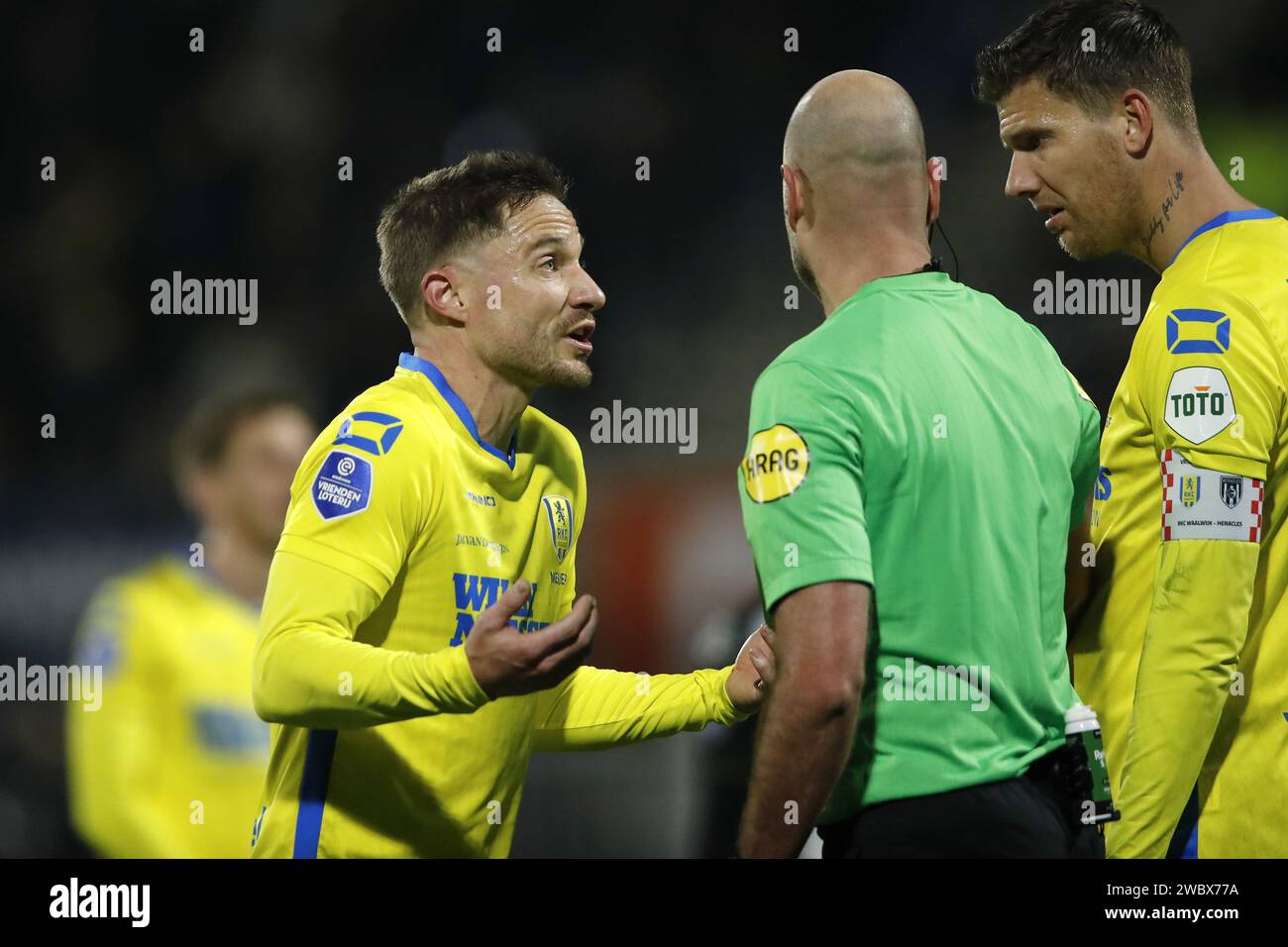 WAALWIJK - (l-r) Aaron Meijers of RKC Waalwijk, referee Rob Dieperink, Michiel Kramer of RKC ...