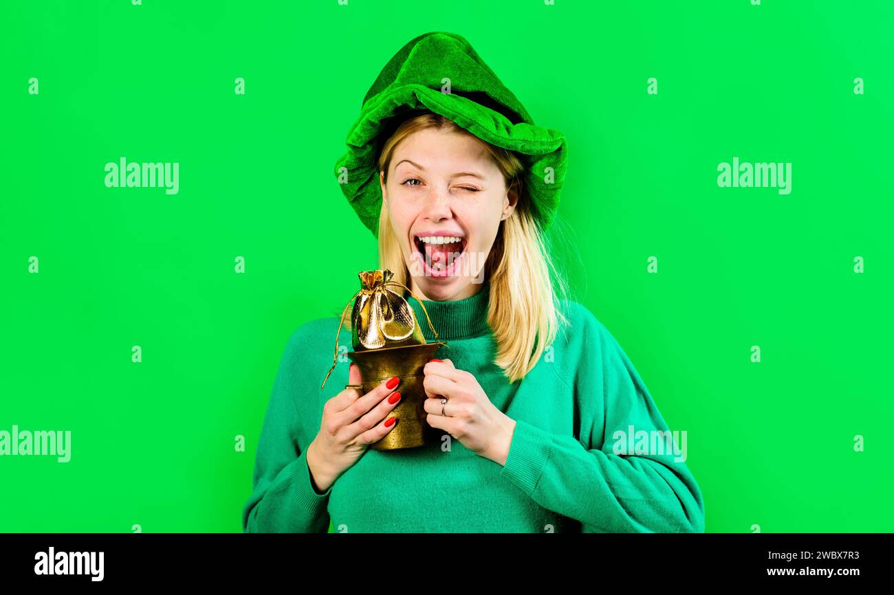 Beautiful Saint Patrick's day girl with pot of gold. Winking blonde ...