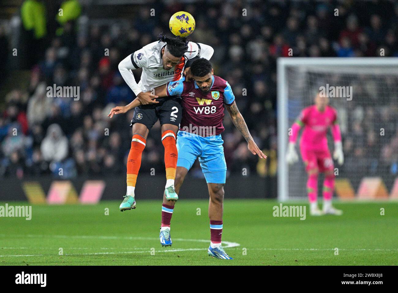 Burnley, UK. 12th Jan, 2024. Gabriel Osho of Luton Town and Vitinho of ...
