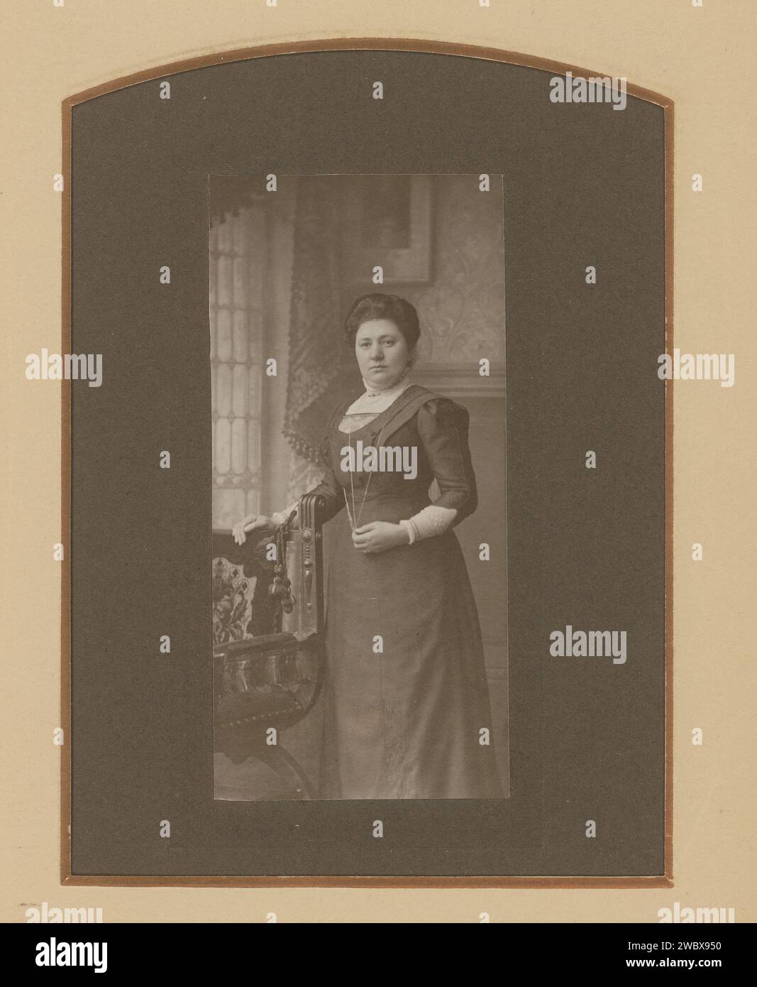 Portrait of a woman with necklace, standing by a chair, Friedrich Carel ...