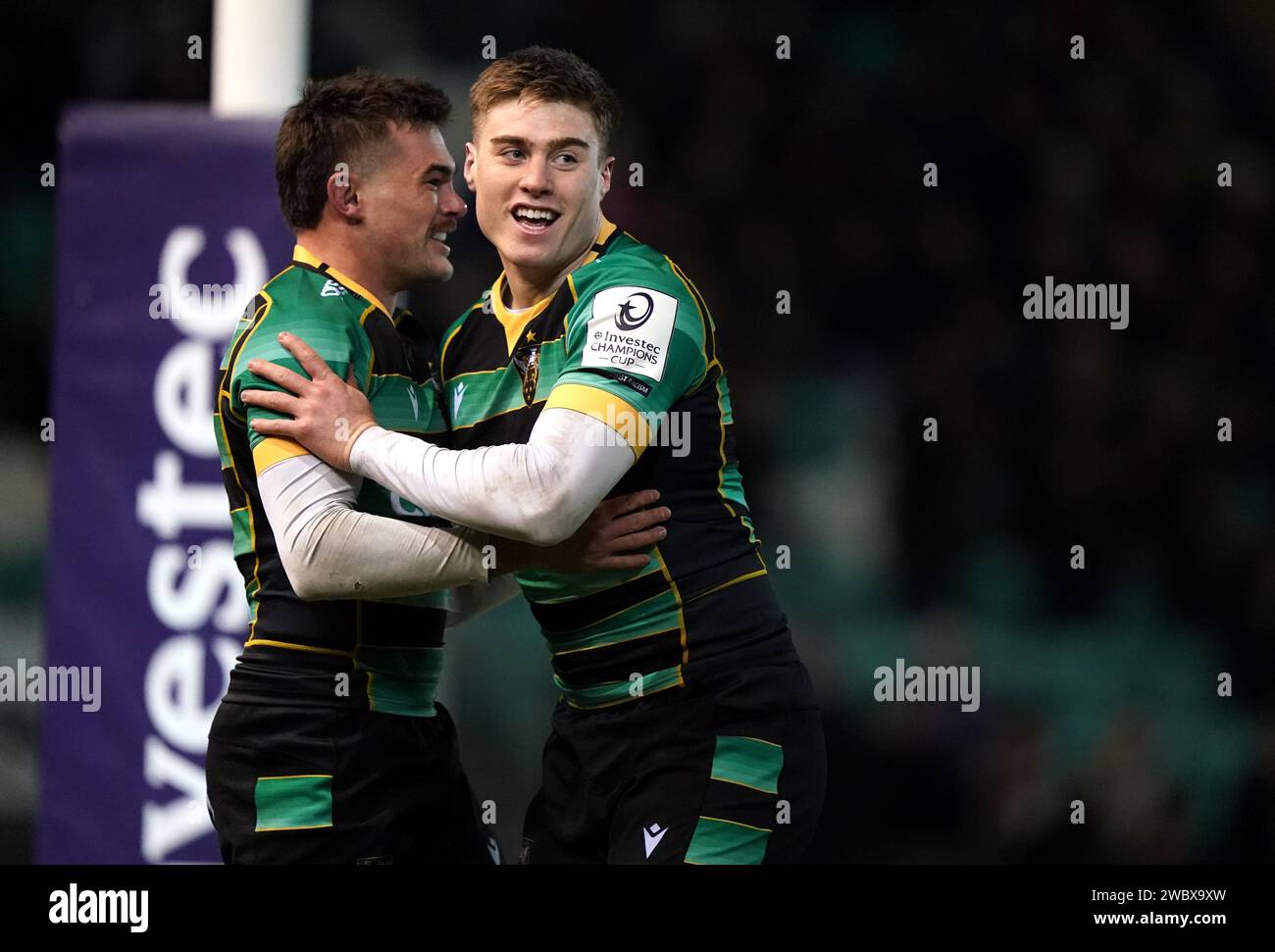 Northampton Saints' Tommy Freeman (right) celebrates scoring their side ...