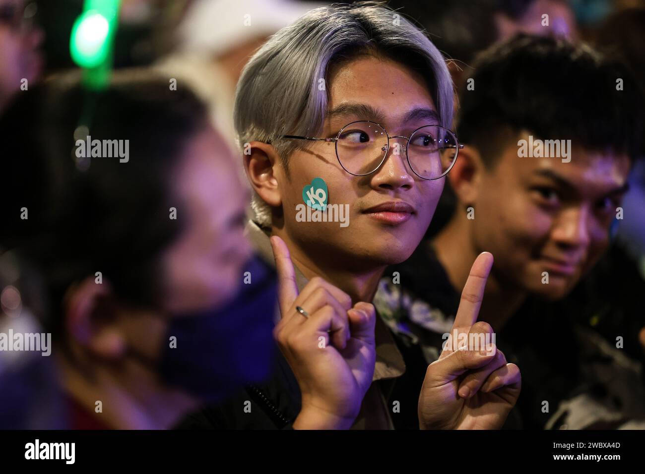 Taipei, Taiwan. 12th Jan, 2024. A supporter of Taiwan People's Party ...