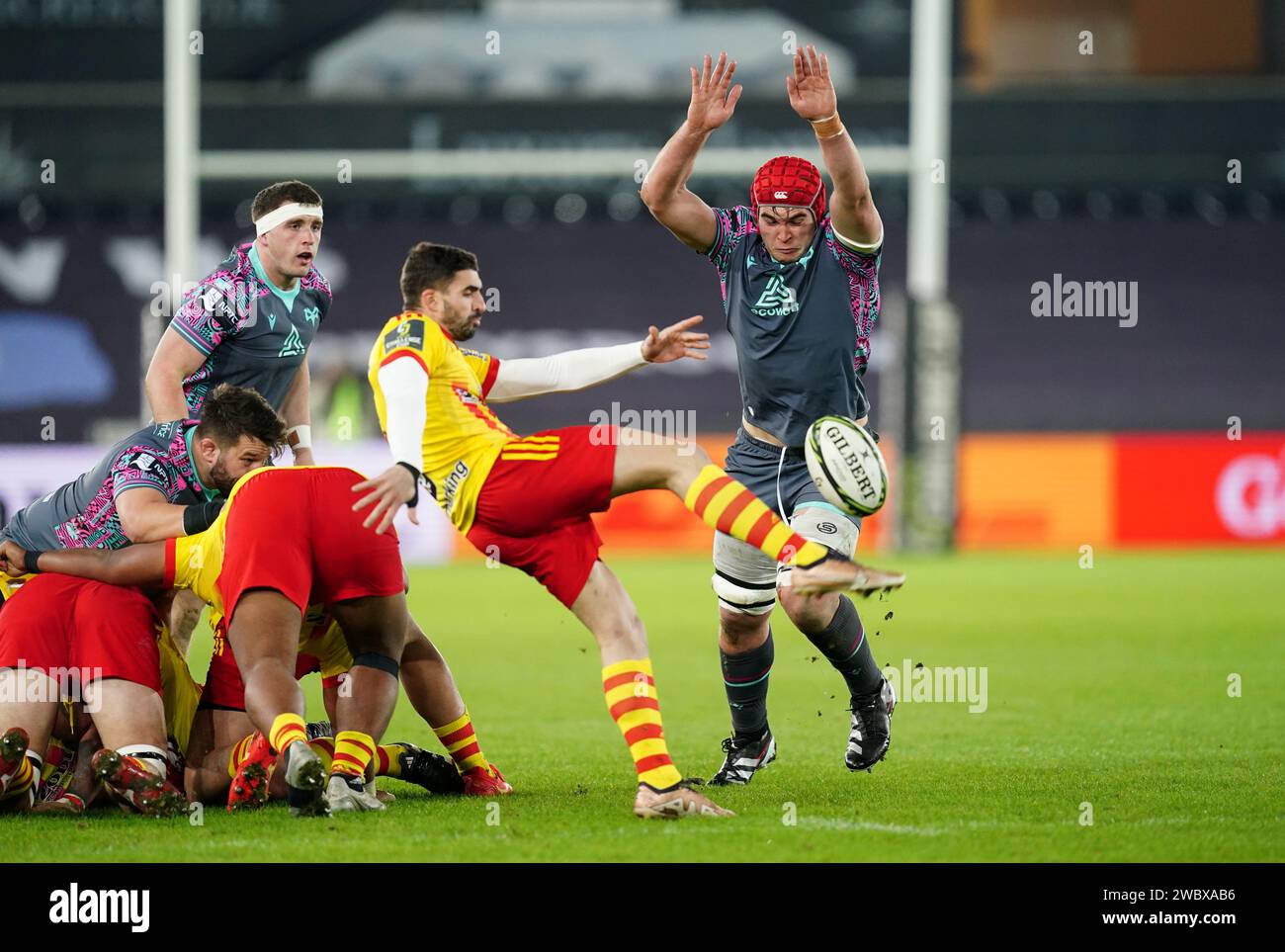 Ospreys' James Fender charges down USA Perpignan's Sadek Deghmache ...