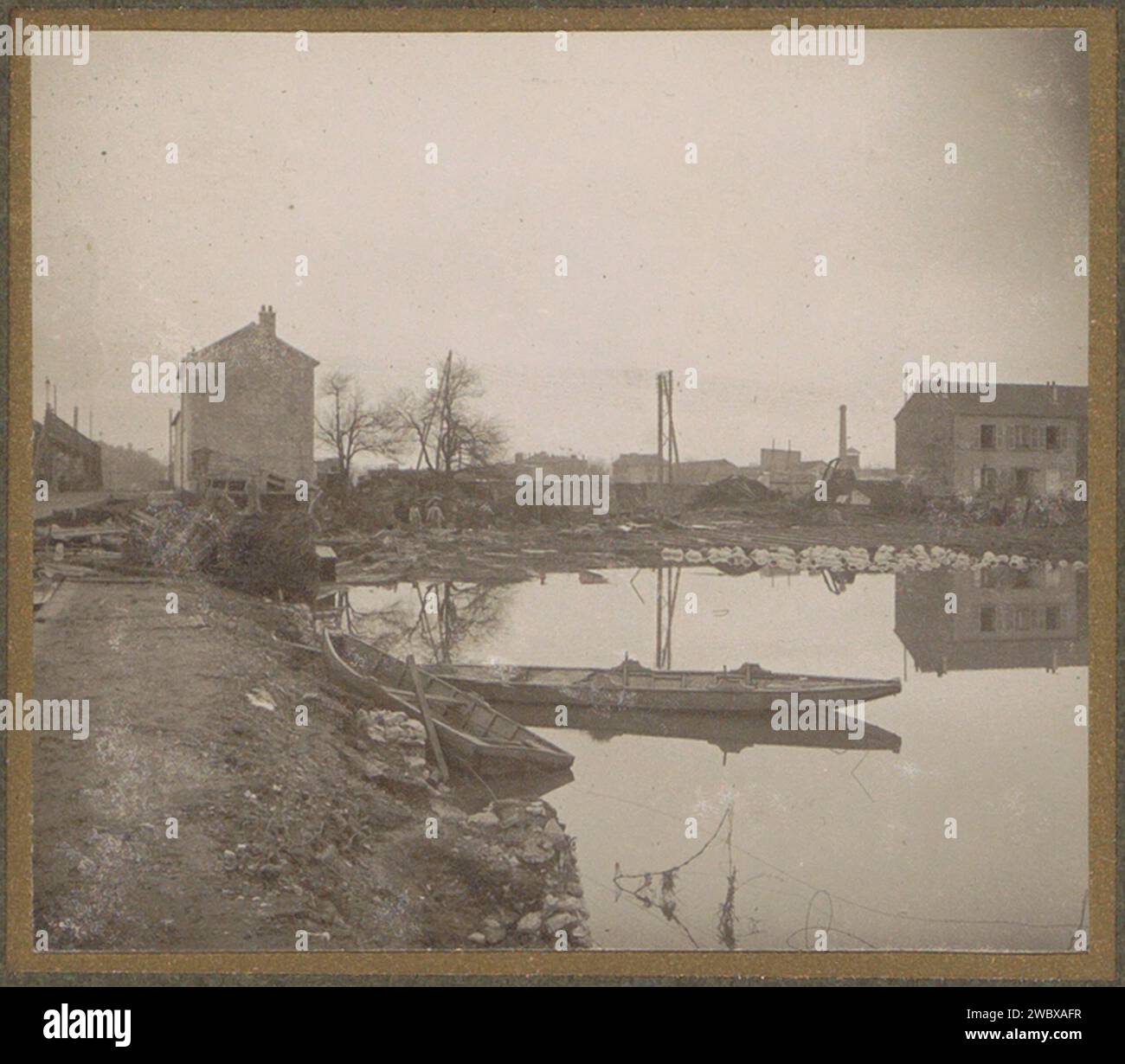 Boot and houses in a flooded suburb of Paris, G. Dangereux, 1910 ...