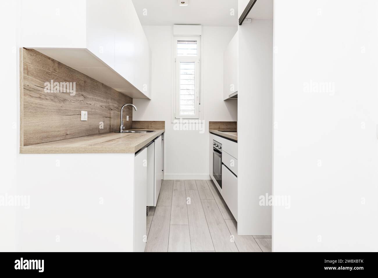 Small kitchen furnished in the absence of appliances with furniture on ...