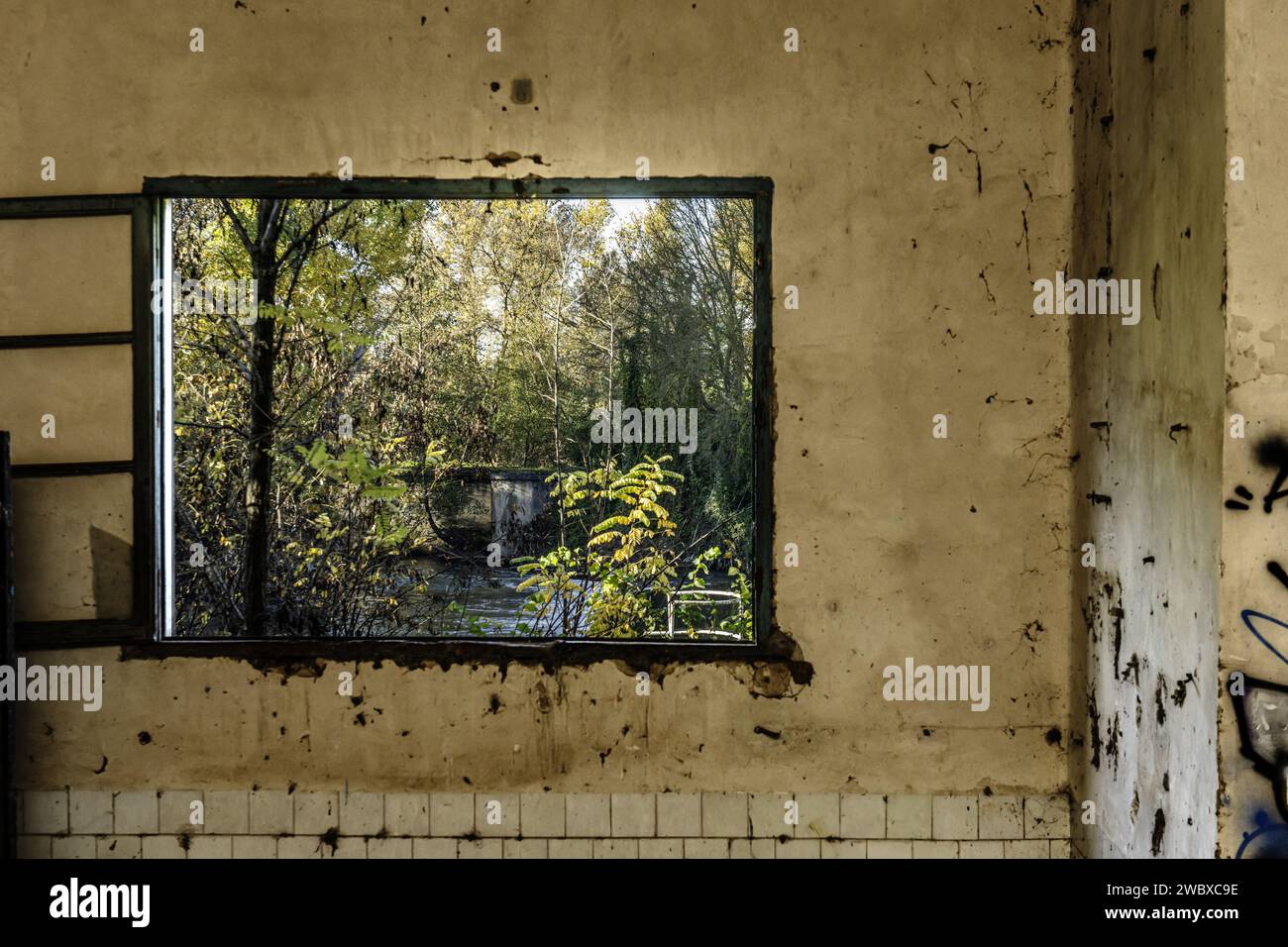 Interior of an abandoned and half-ruined building with dilapidated ...
