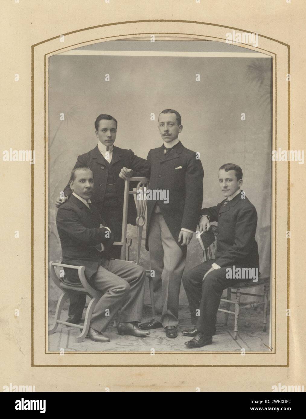Four black men sitting hi-res stock photography and images - Alamy