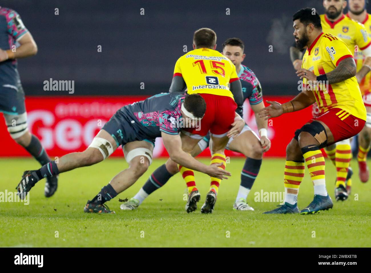 Swansea, UK. 12th Jan, 2024. Morgan Morse of Ospreys tackles Louis ...