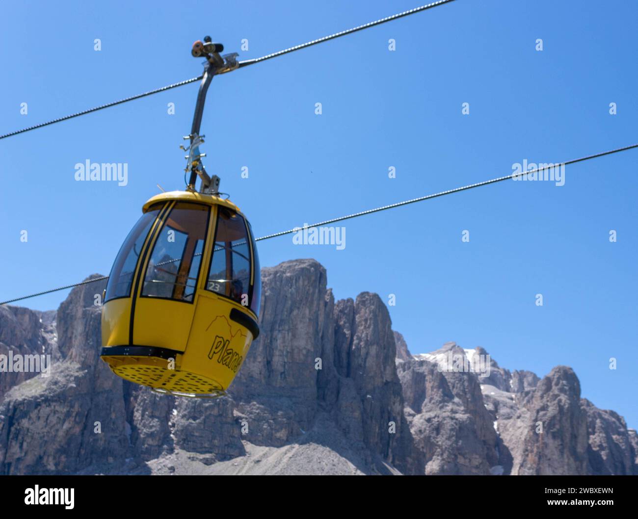 Yellow cable car in the Dolomites - Val Gardena - Italy Stock Photo - Alamy