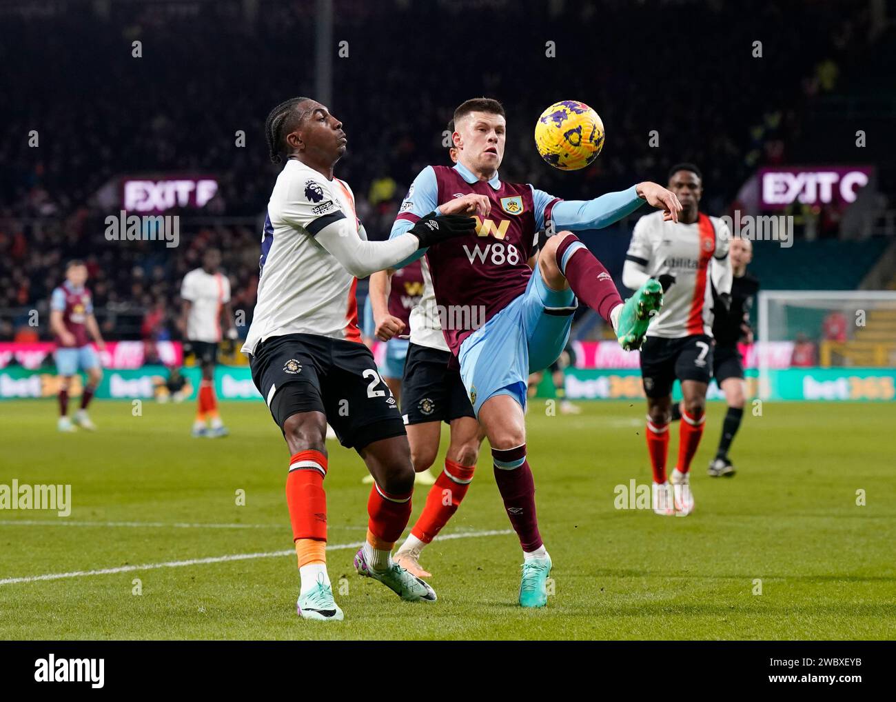 Burnley, UK. 12th Jan, 2024. Johann Gudmundsson of Burnley tussles with ...