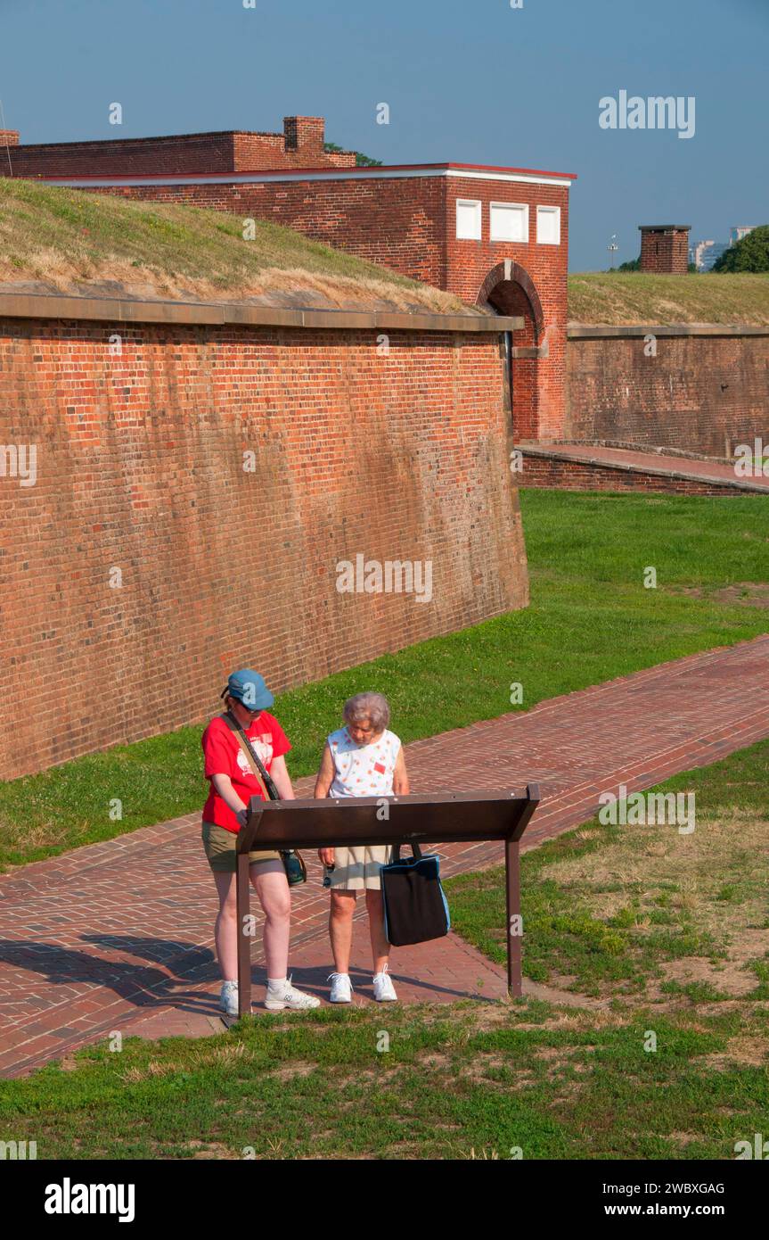 Fort wall with interpretive board, Fort McHenry National Monument and ...