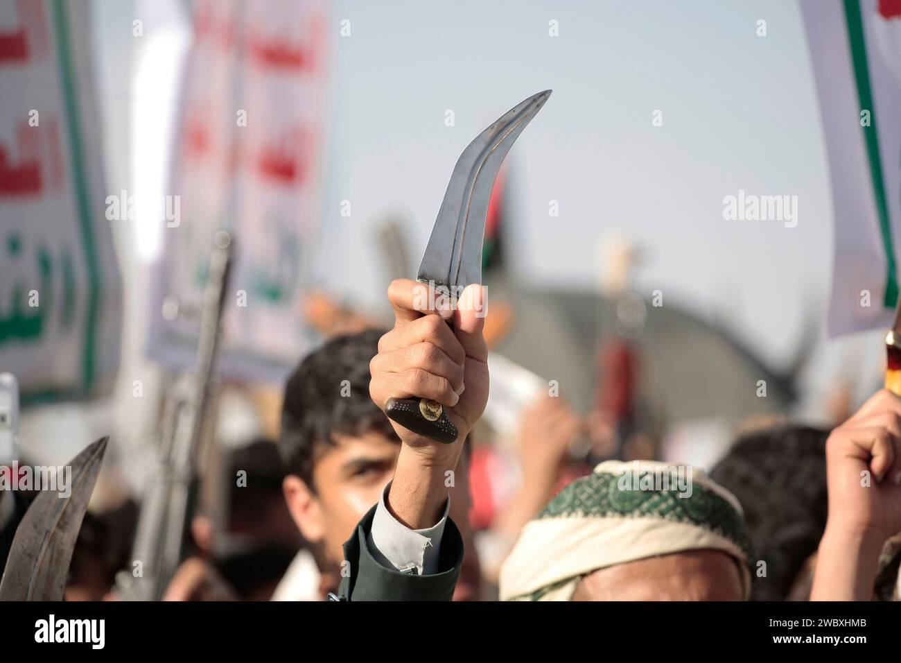Sanaa, Sanaa, Yemen. 12th Jan, 2024. A man holds up a Yemeni dagger ...