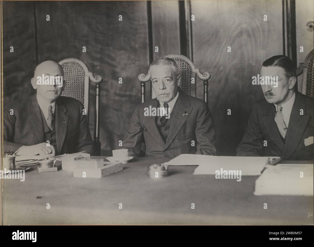 Three men at a table, presumably in a boardroom, c. 1920 - 1930 ...