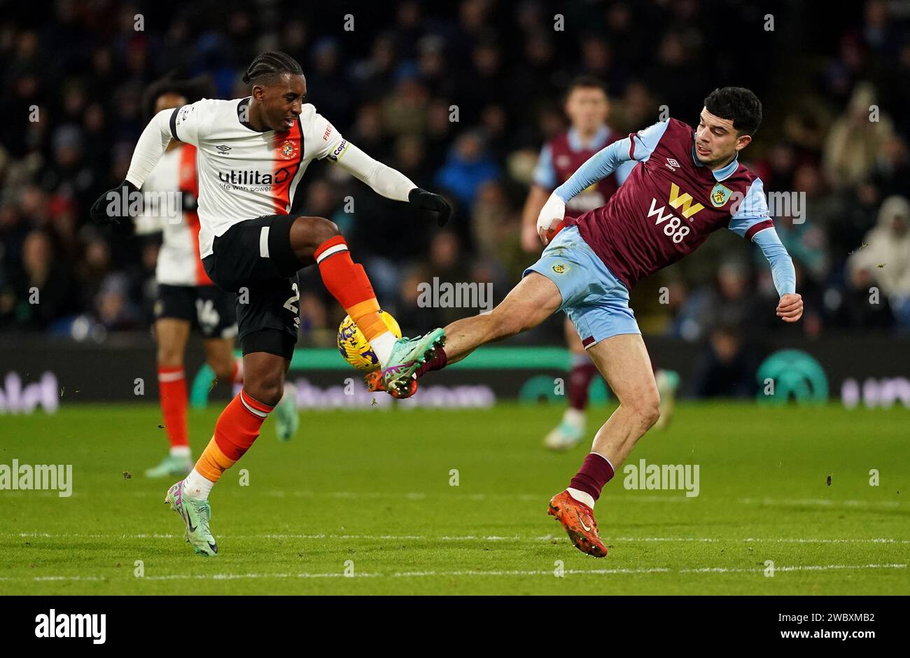 Luton Town's Amari'i Bell (left) and Burnley's Zeki Amdouni battle for ...