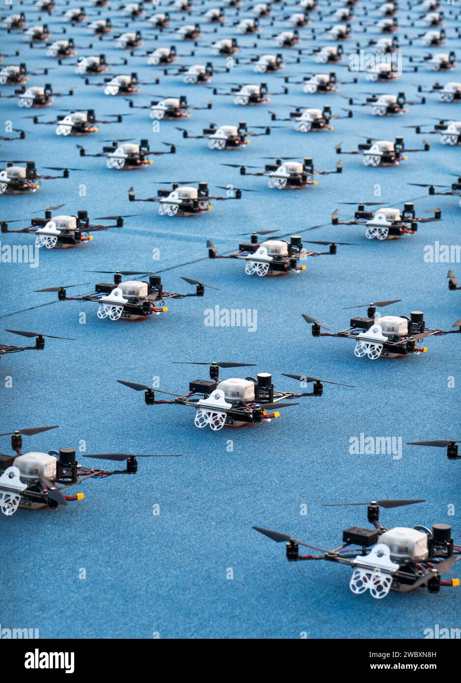 doha, qatar- december 12,2023 : multiple drones lined up for a drone ...