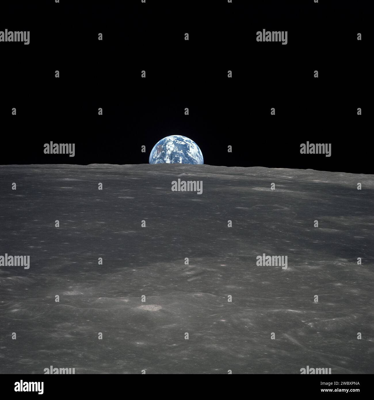 View from Apollo 11 spacecraft of moon with Earth on horizon, Mare ...