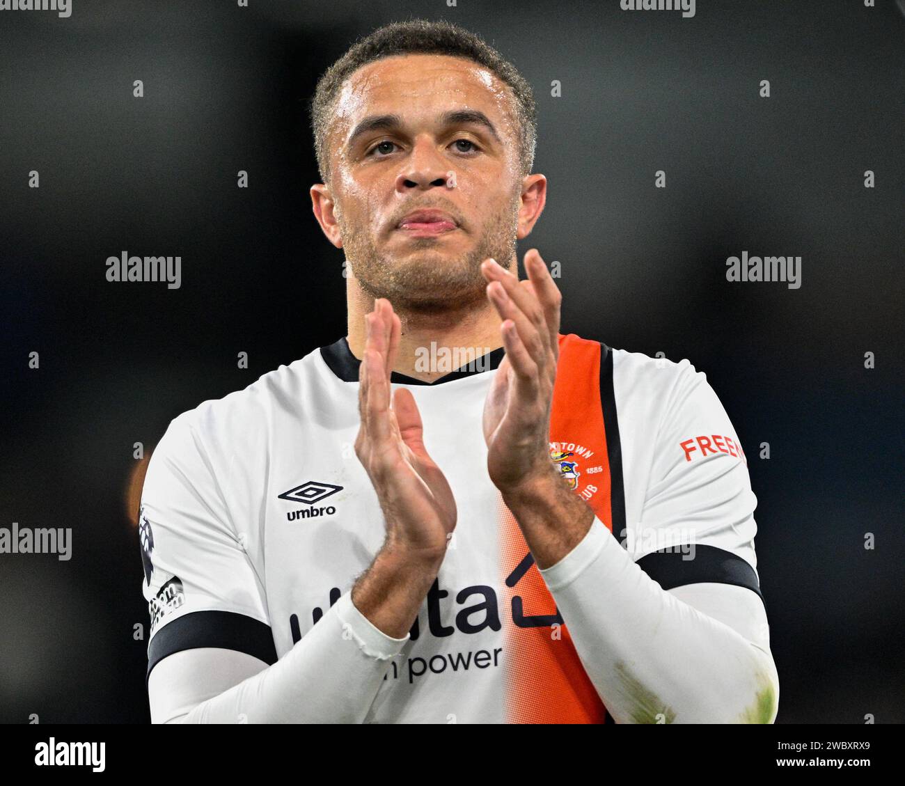 Burnley, UK. 12th Jan, 2024. Carlton Morris of Luton Town applauds the ...