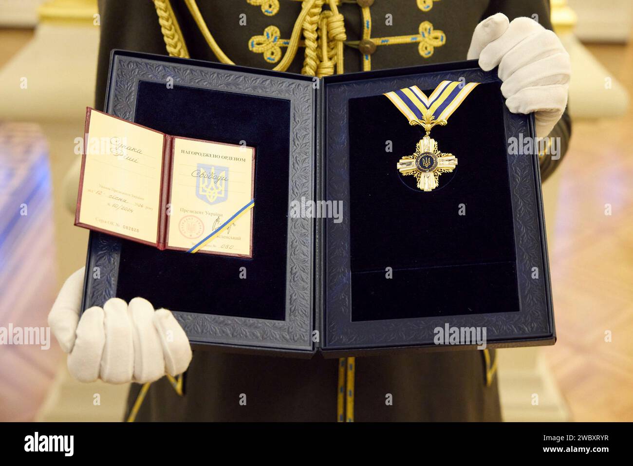 Kiev, Ukraine. 12th Jan, 2024. A Ukrainian honor guard holds the Order ...