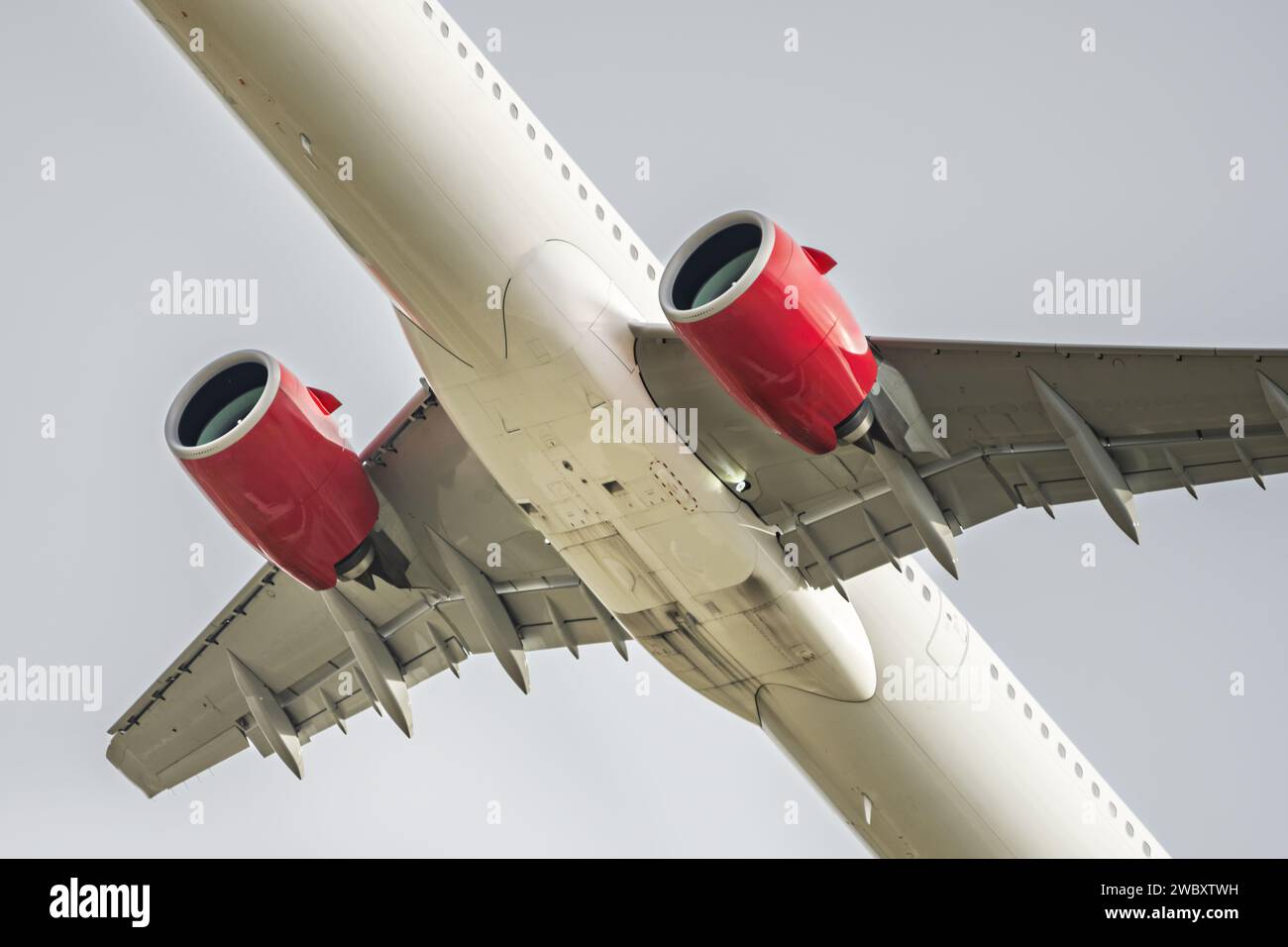 Fuselage of an airline passenger plane taking flight towards its ...