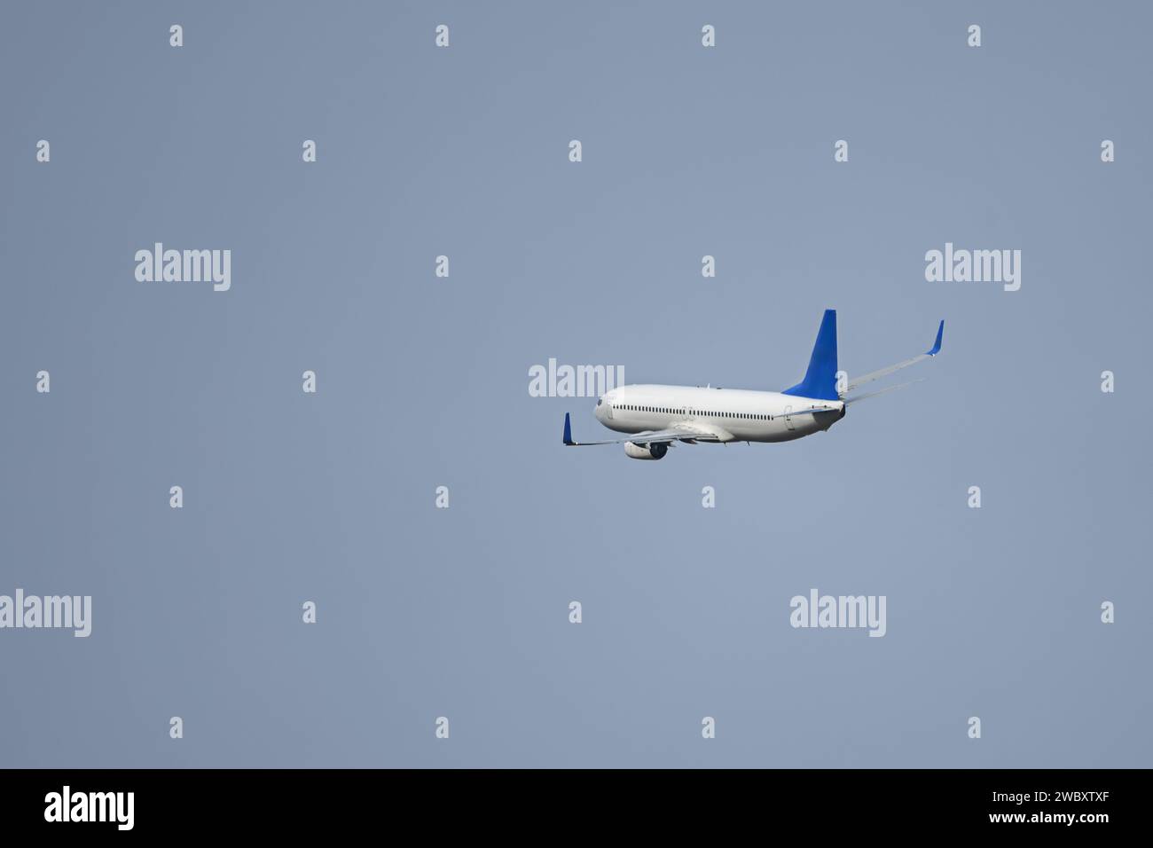 a jet cargo plane a few minutes after takeoff turning in the air to ...