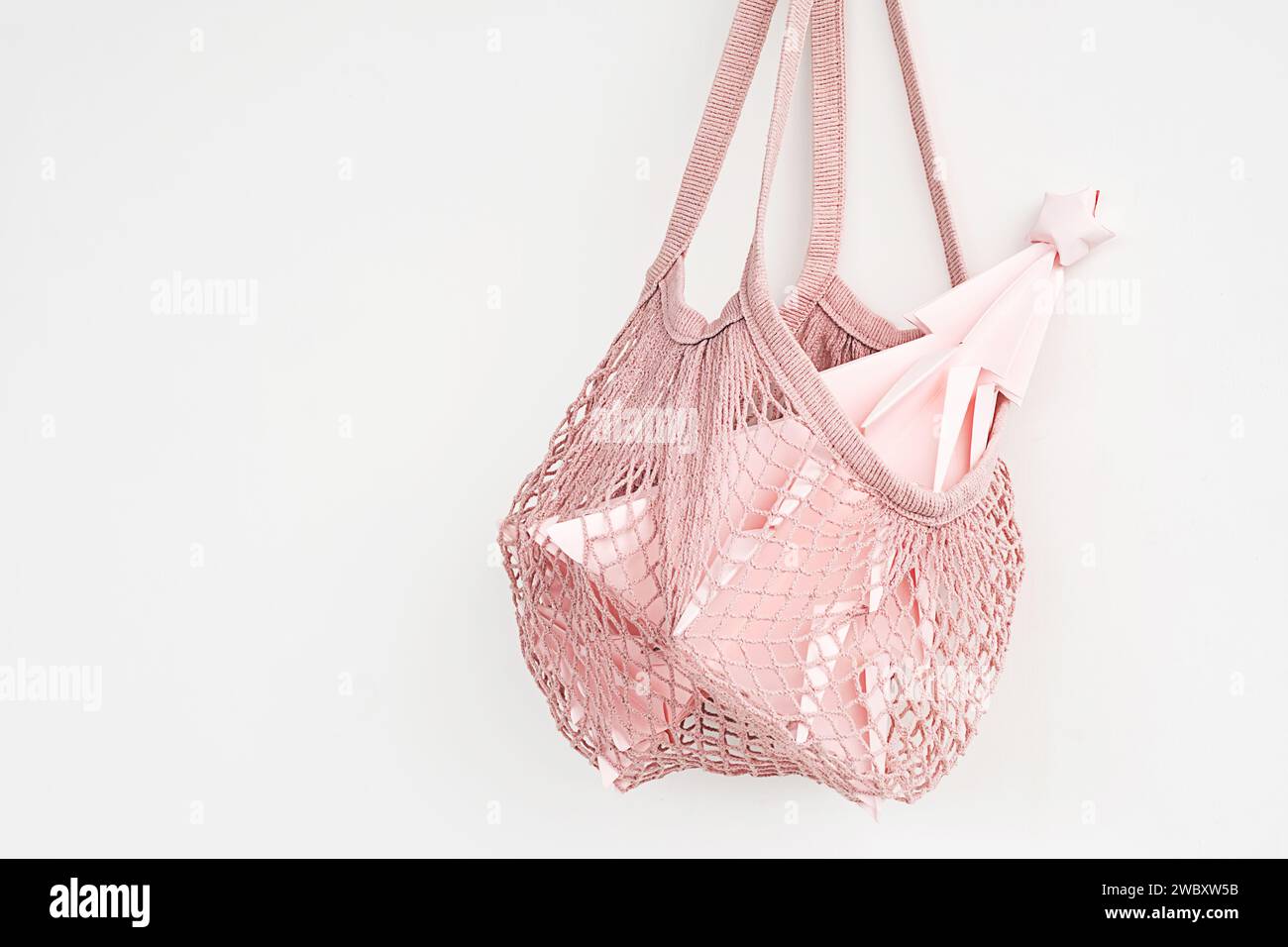 Origami Christmas tree in mesh shopping bag. Zero waste holiday ...