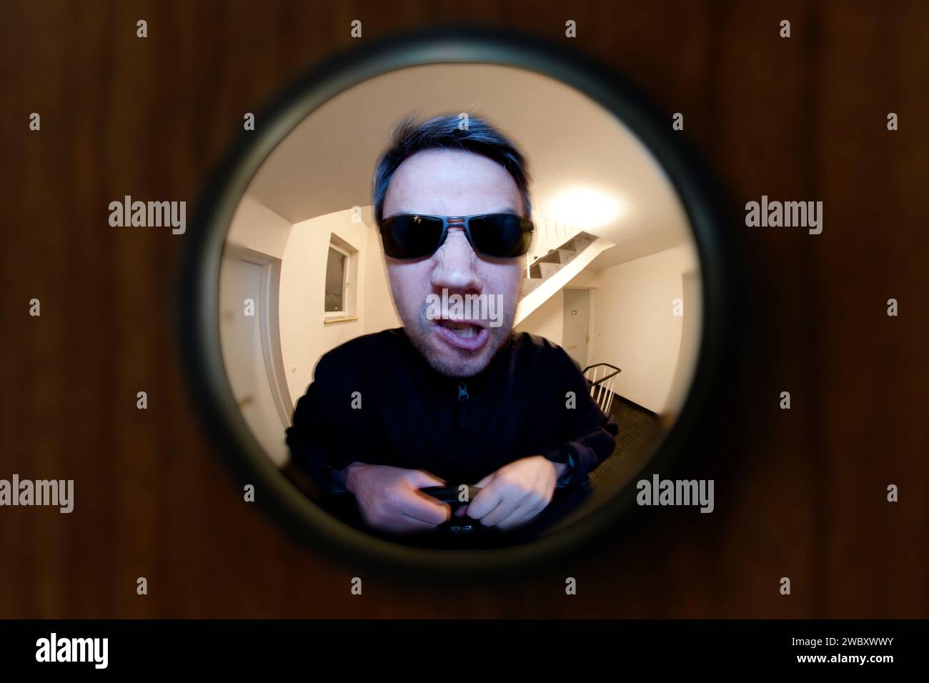 Peep hole man hi-res stock photography and images - Alamy