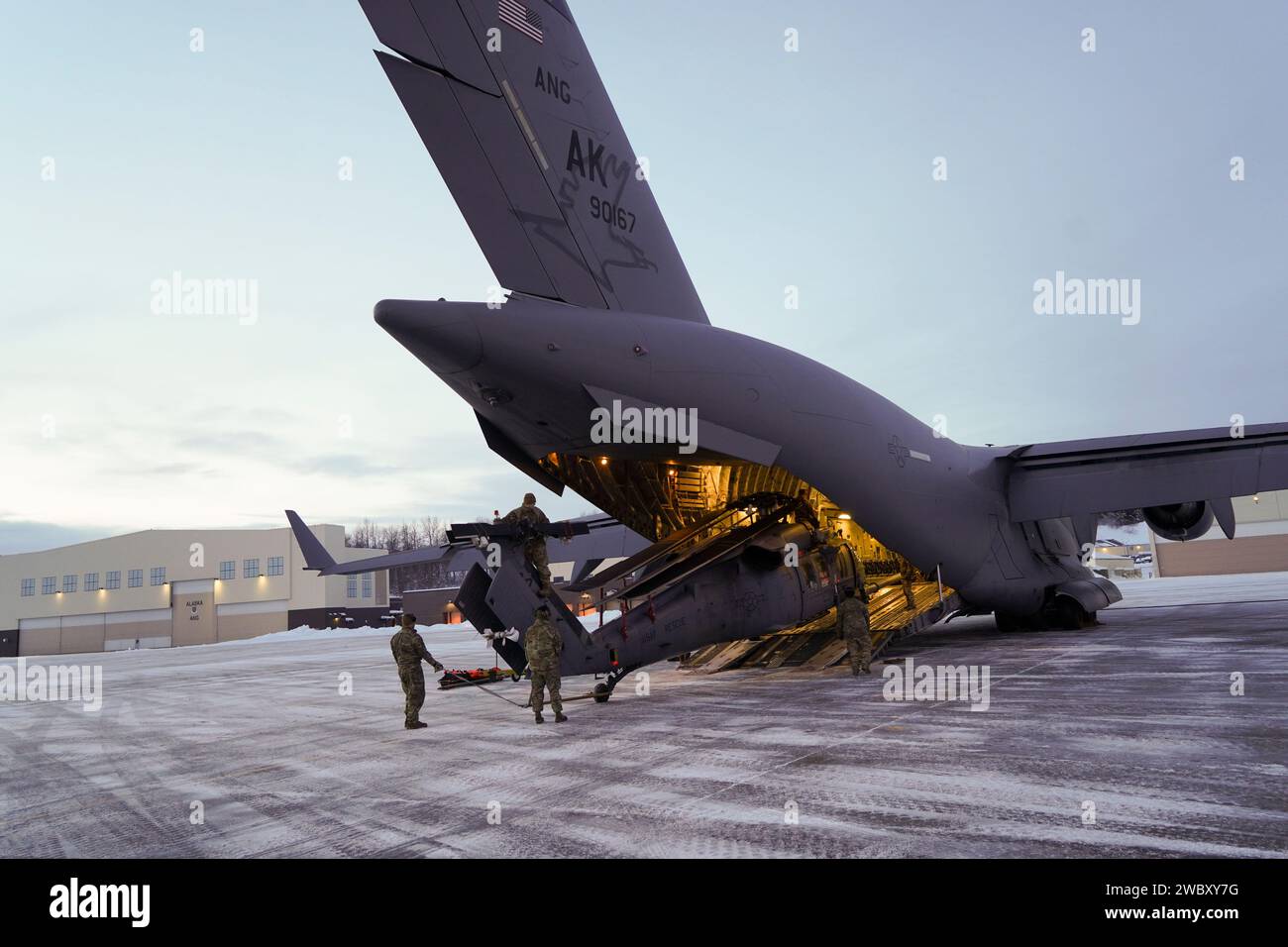 Airmen from the 176th and 718th Aircraft Maintenance Squadrons off-load ...