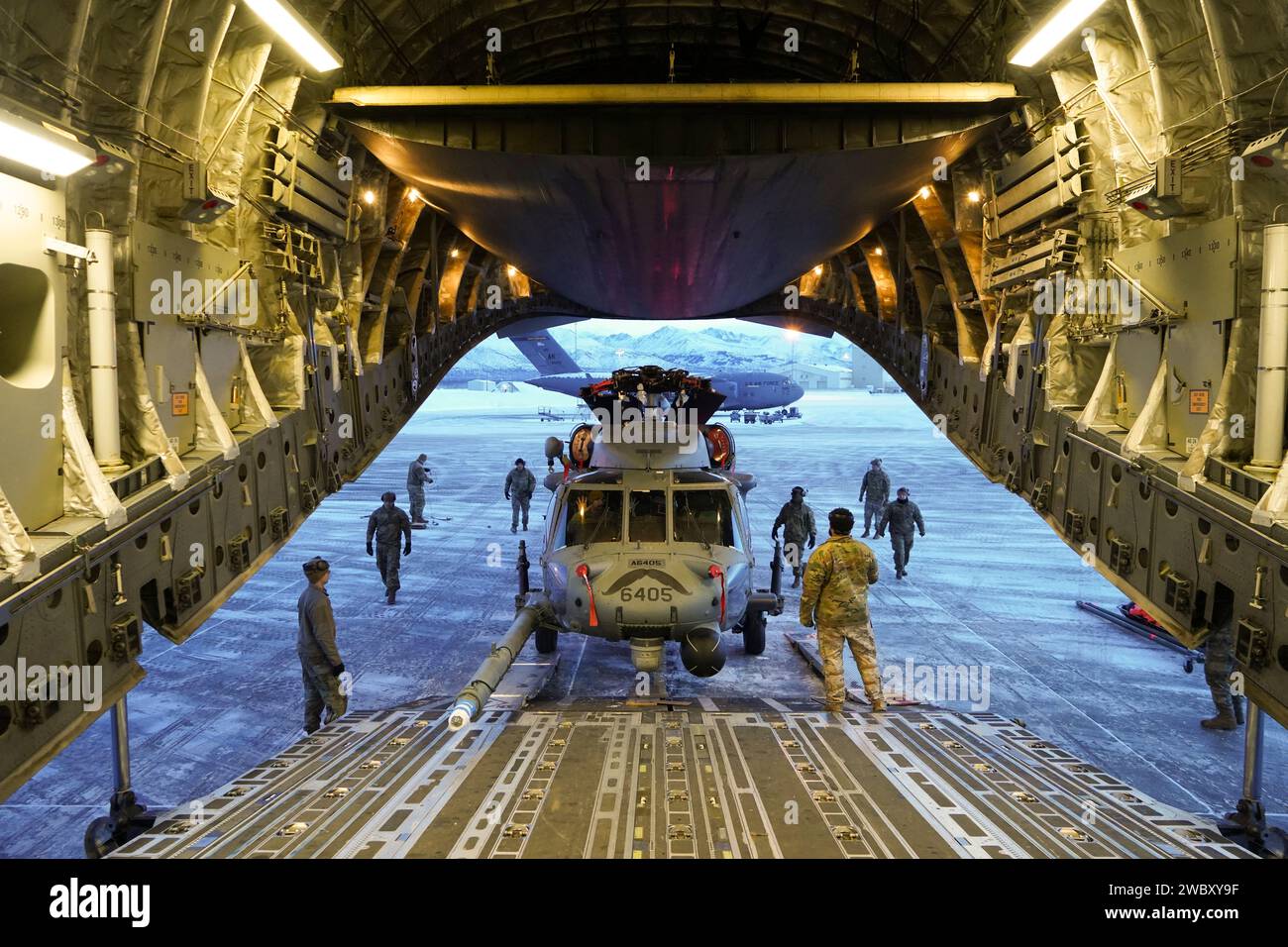 Airmen from the 176th and 718th Aircraft Maintenance Squadrons off-load ...