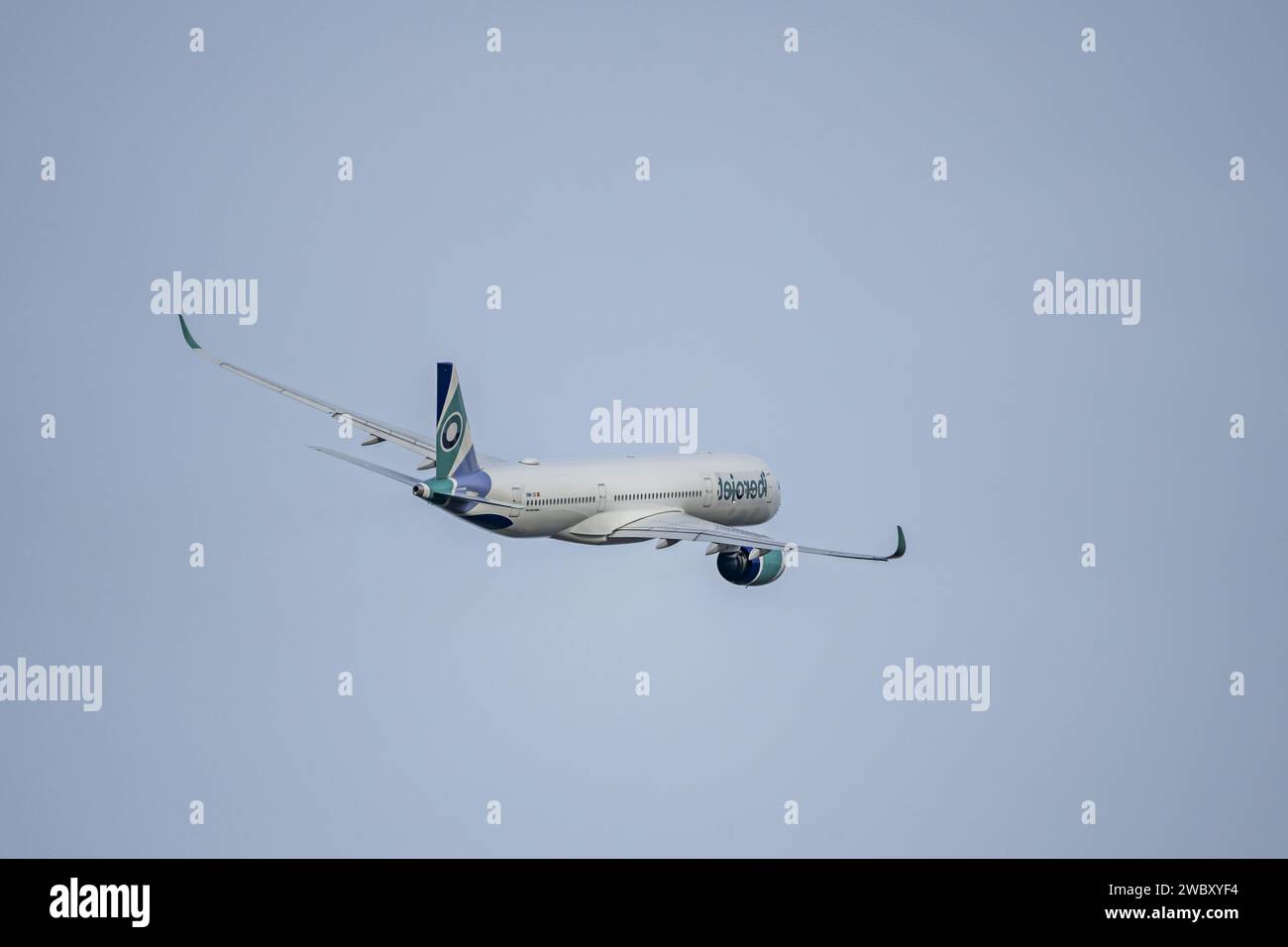 Rear image of an airplane turning in the sky to head towards its ...