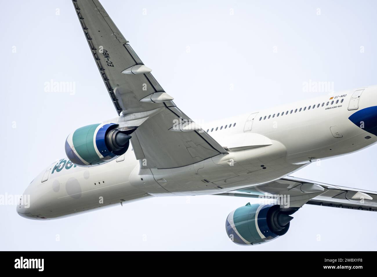 Below image of the fuselage of an airplane turning in the sky to head ...