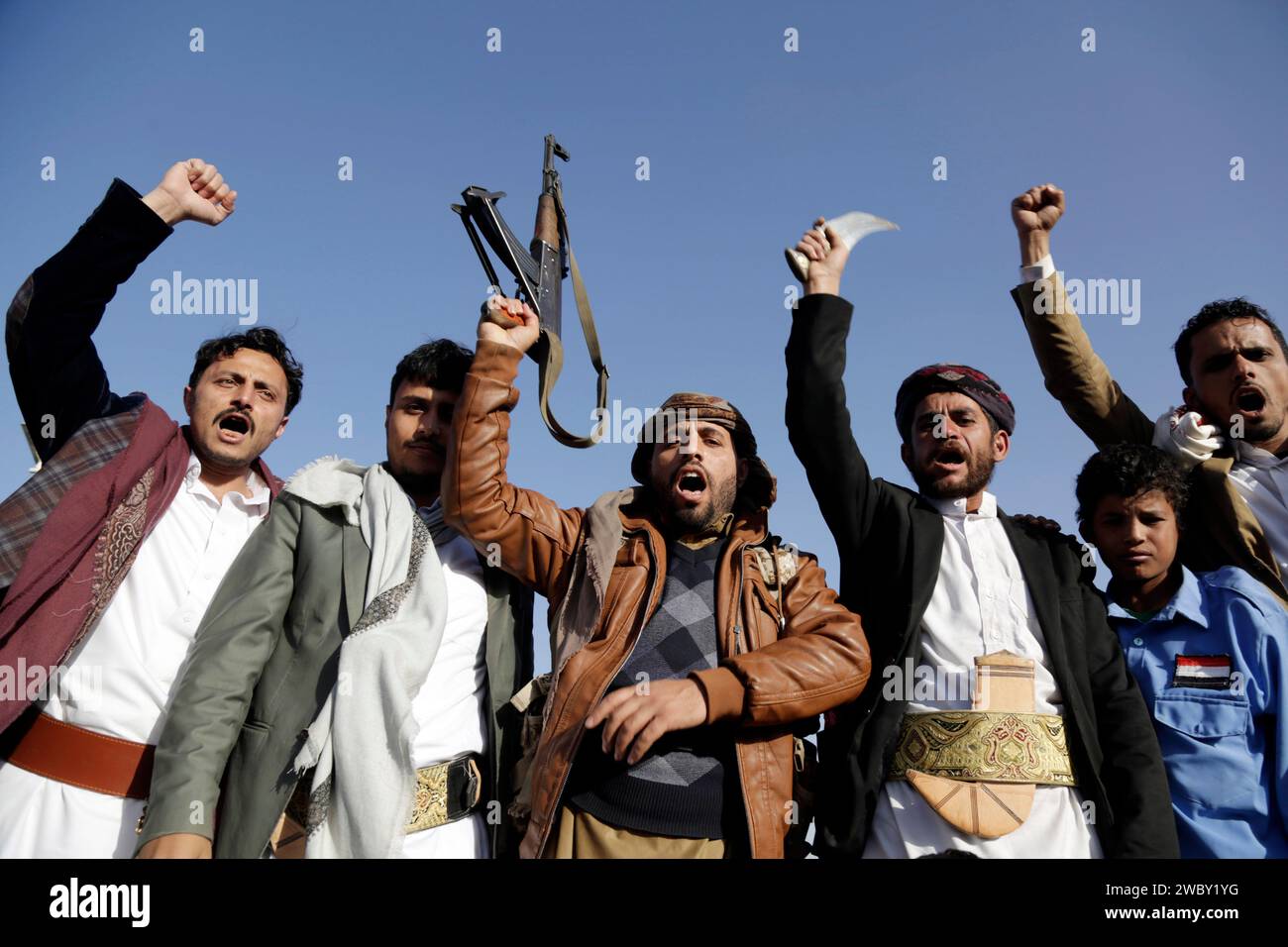 Sanaa, Yemen. 12th Jan, 2024. Yemenis chant slogans as they participate ...