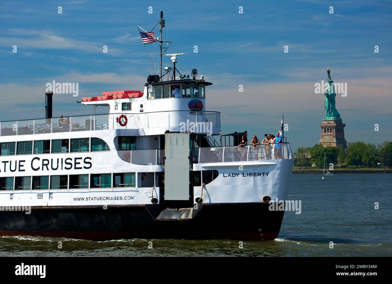 Statue of Liberty tour boat with Statue of Liberty, Ellis Island ...