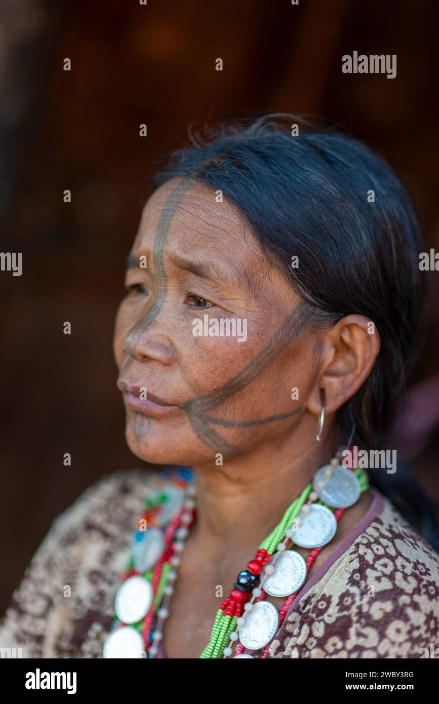 Portrait of a Ollo Nocte old woman with facial tattooes, Lazu village ...