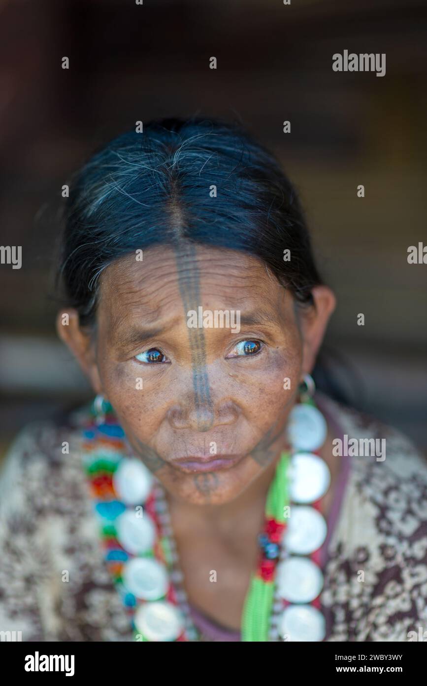 Portrait of a Ollo Nocte old woman with facial tattooes, Lazu village ...