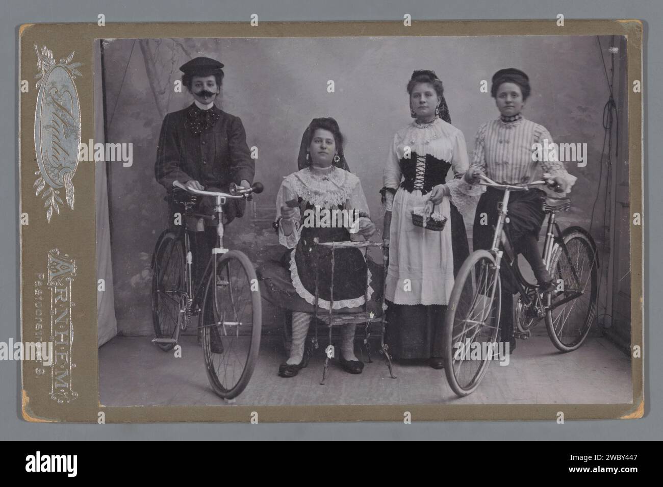 Group portrait of four unknown girls in traditional costumes with ...