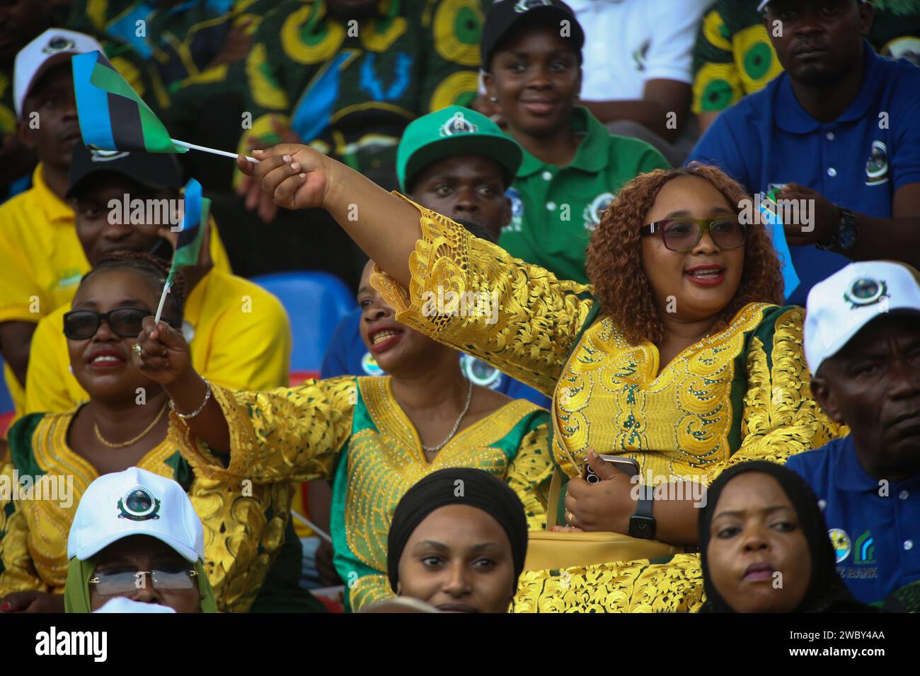 Zanzibar, Tanzania. 12th Jan, 2024. Zanzibari people wave flags during ...
